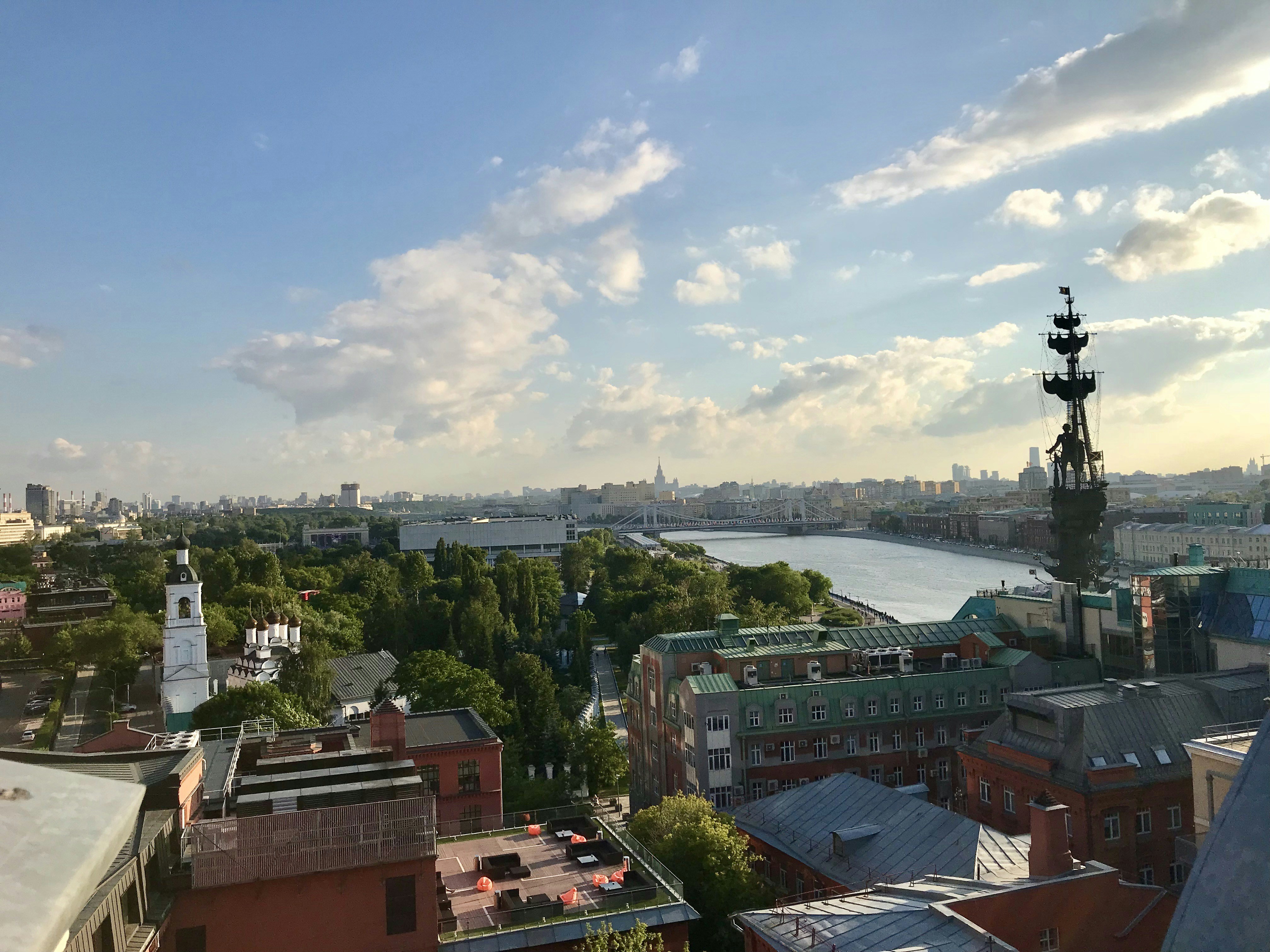 A view of a city and a river from a rooftop photo – Free Building Image ...