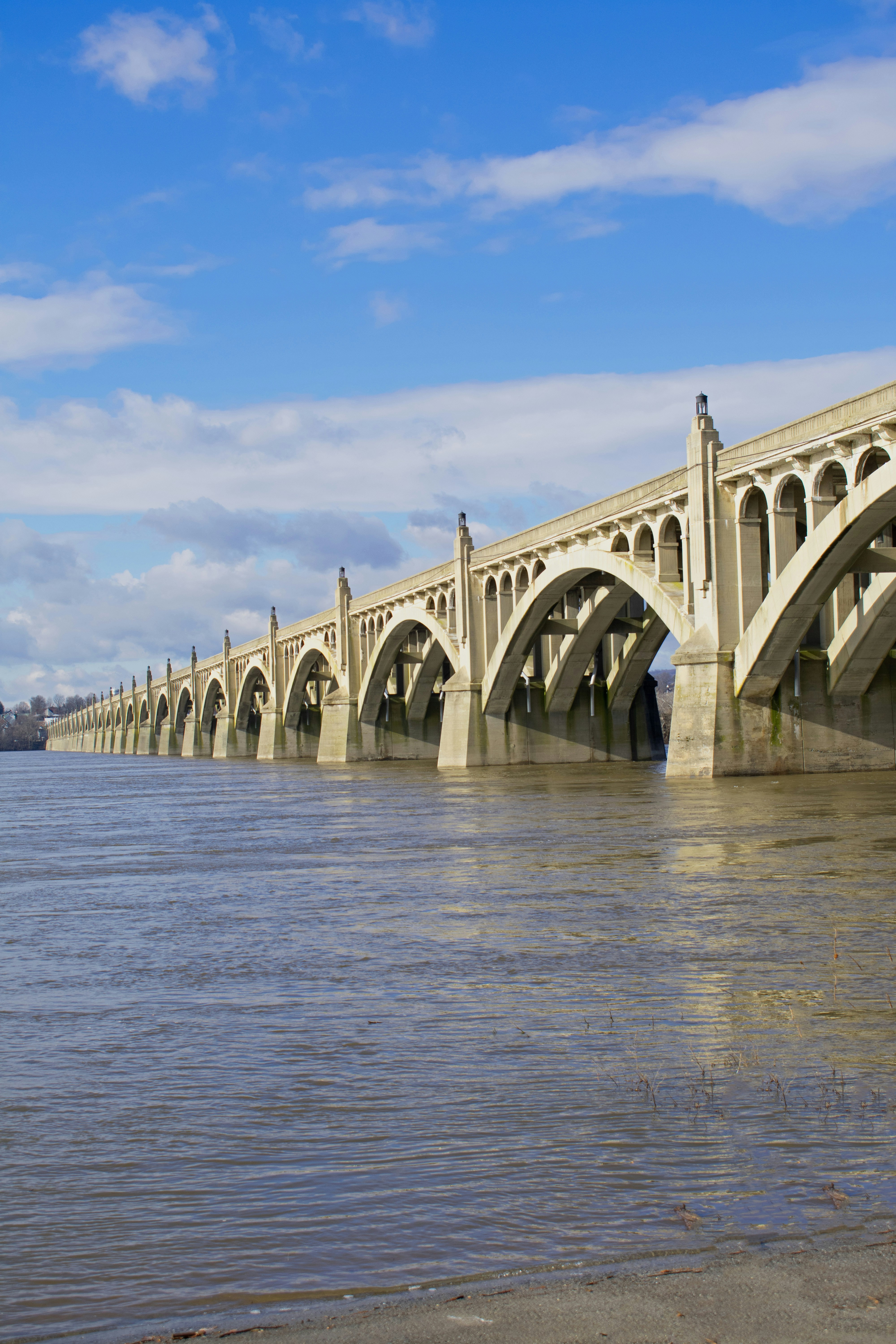 Stone Arches Over the River: A Quiet Span under a Clear Sky