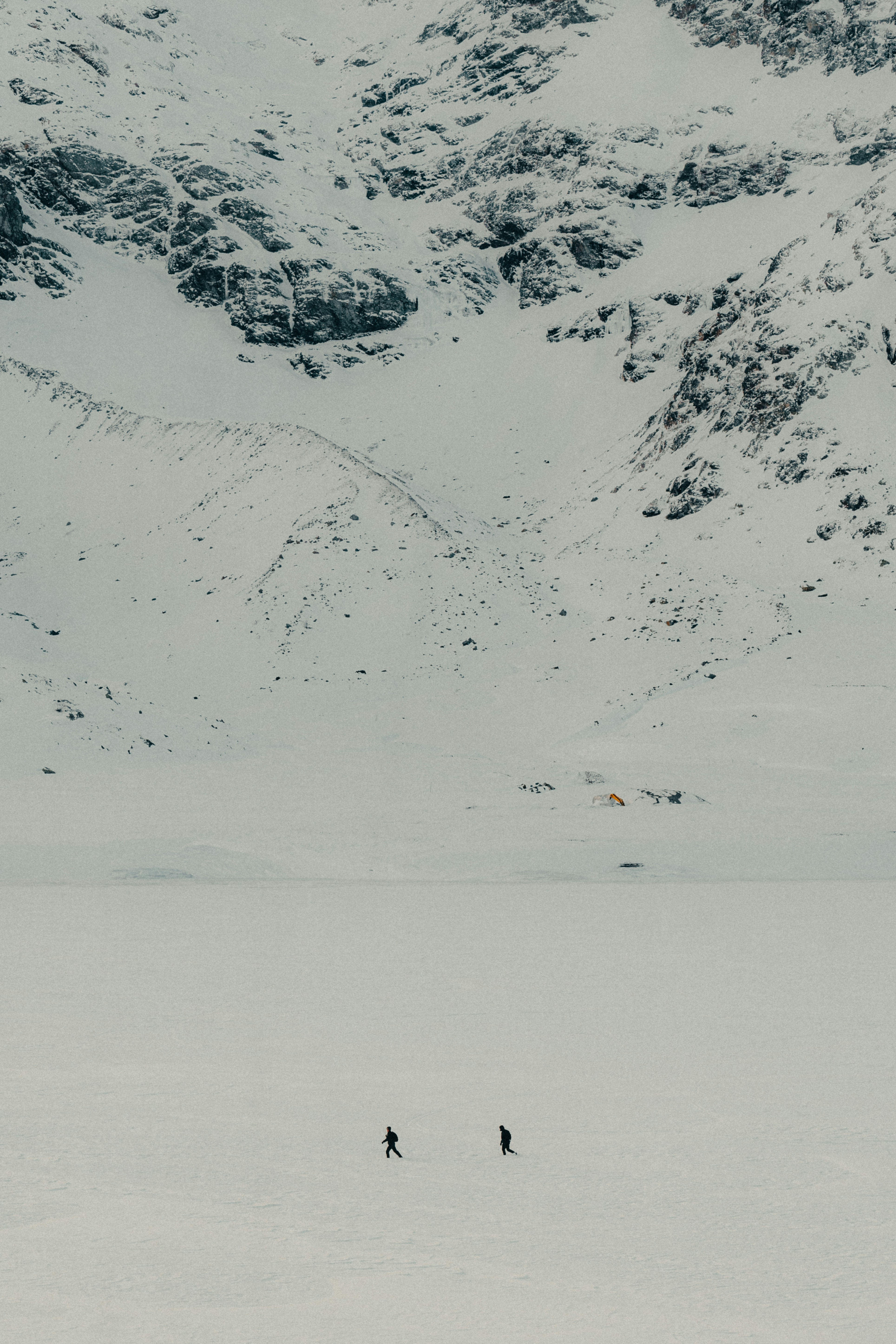 Shot took on the Bernina’s train in Switzerland. Two nomads walking through the snow. Follow IG for more : @sir.simo