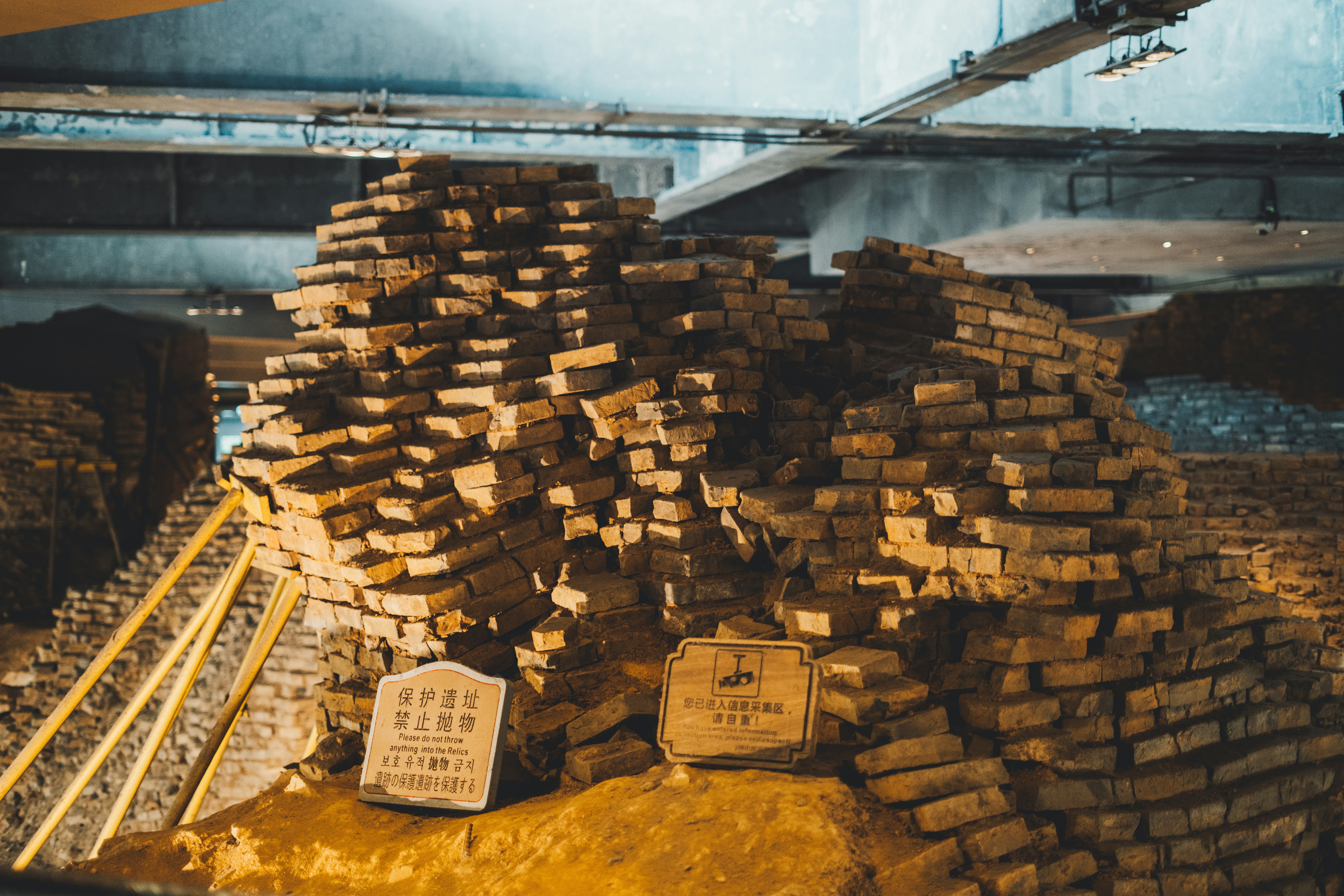 Carefully Piled Timber Under Industrial Ceiling