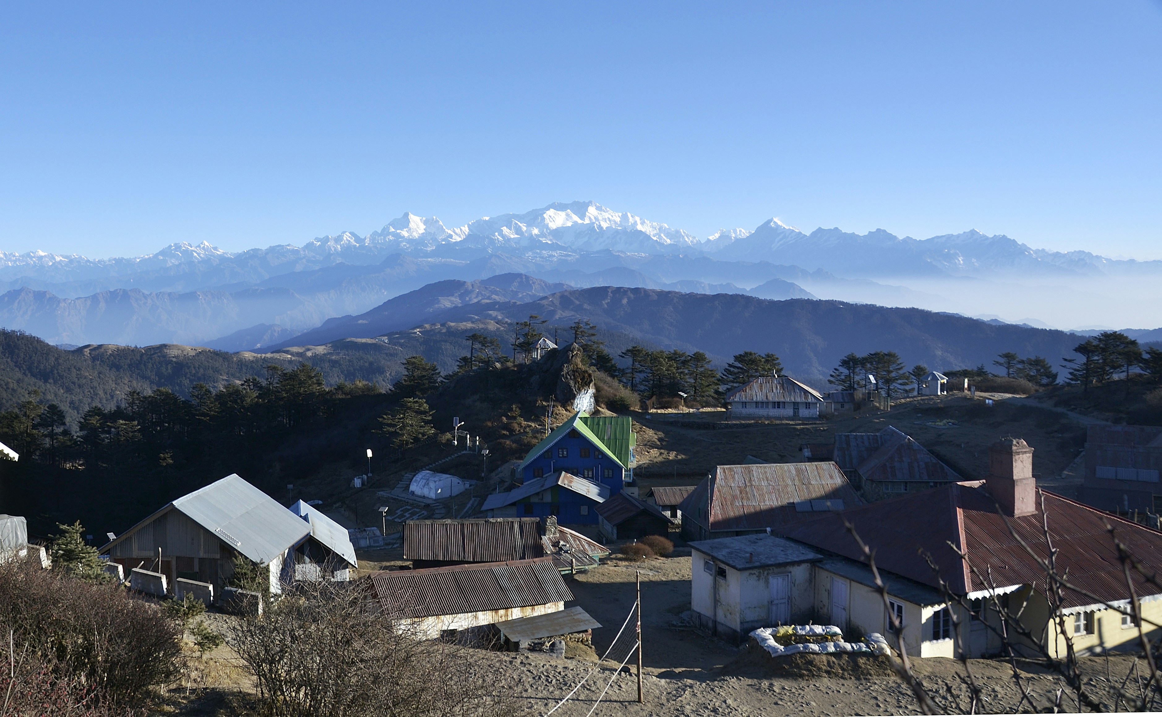 A small village with mountains in the background photo – Free Image on ...