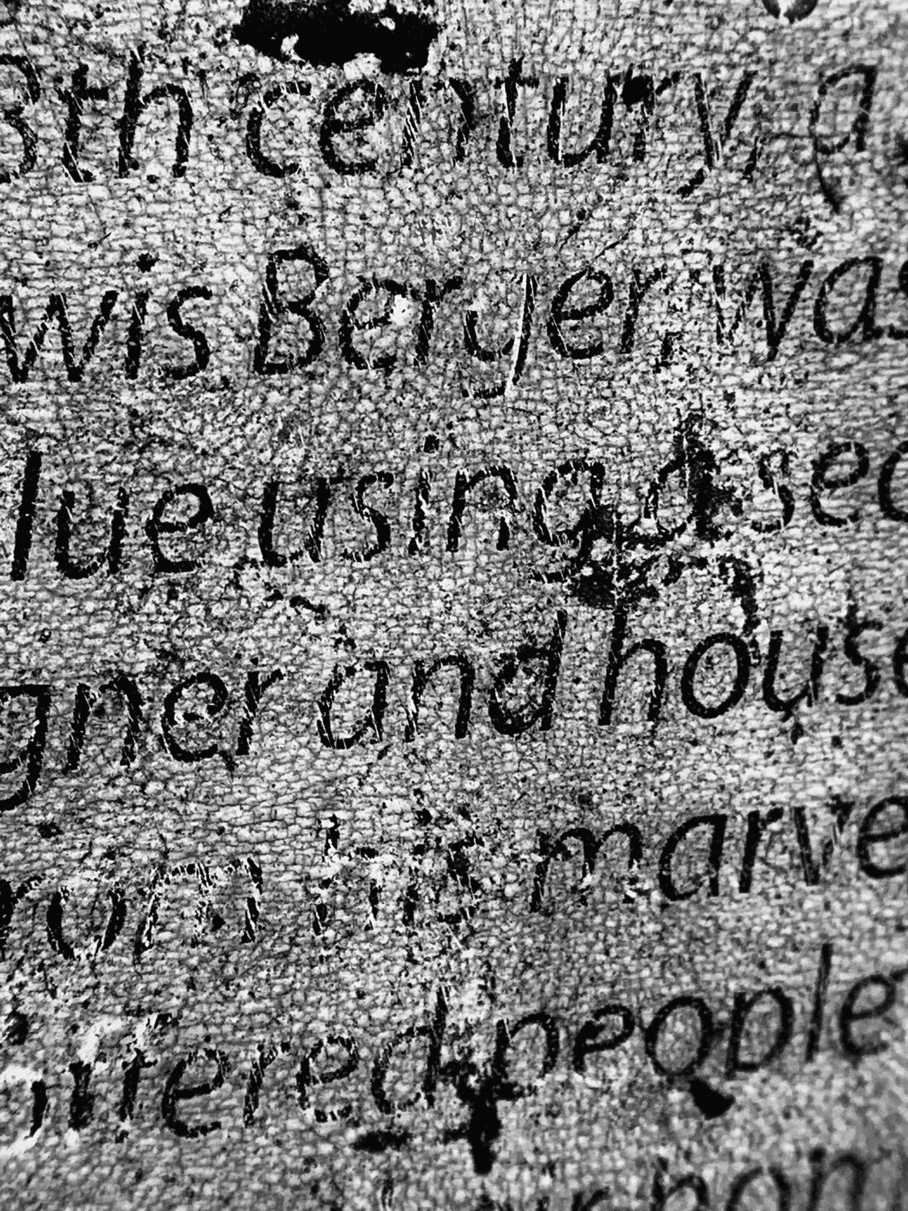 A close up of a stone with writing on it photo – Free Text Image on ...