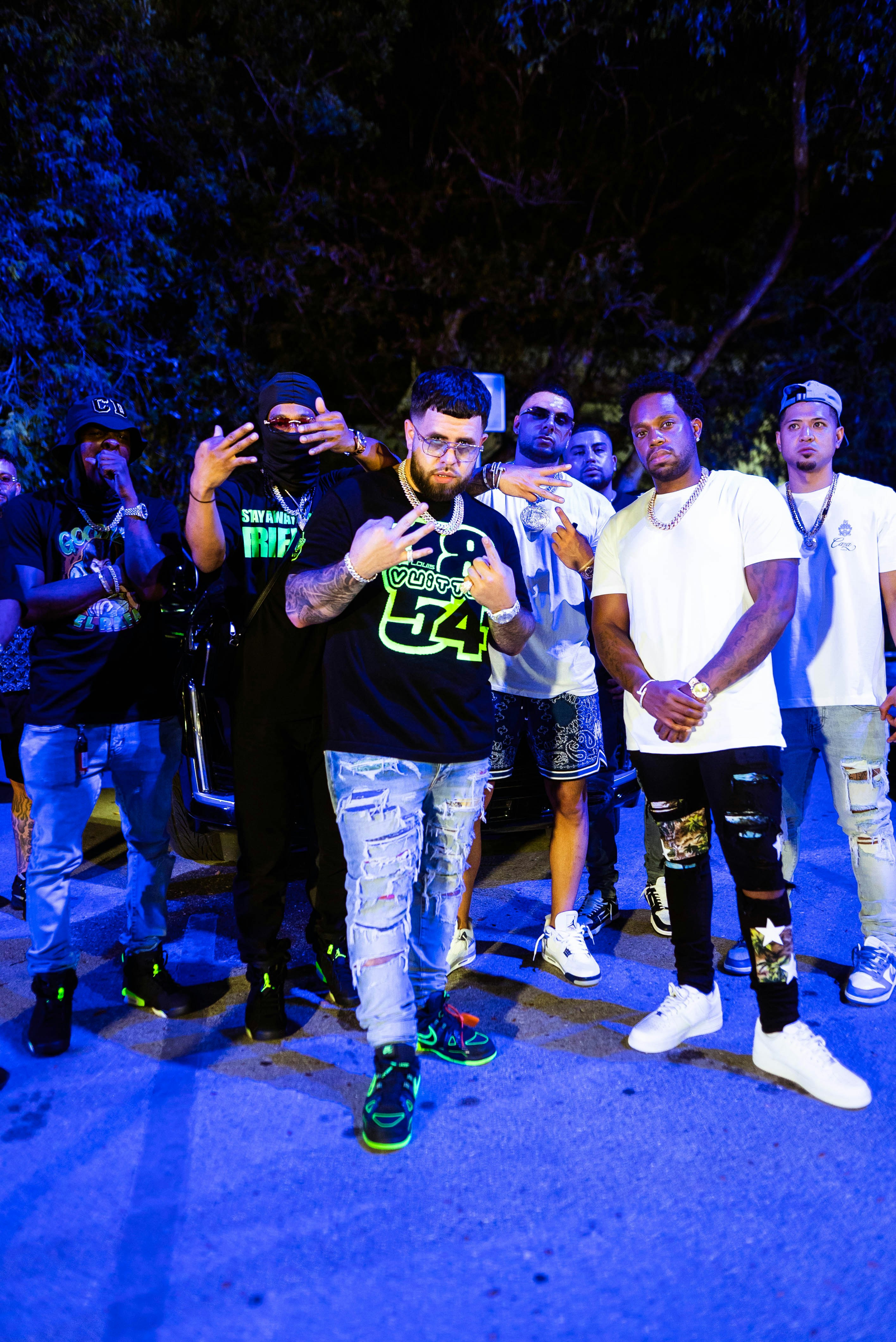 A group of men standing around each other photo – Free Portrait Image ...