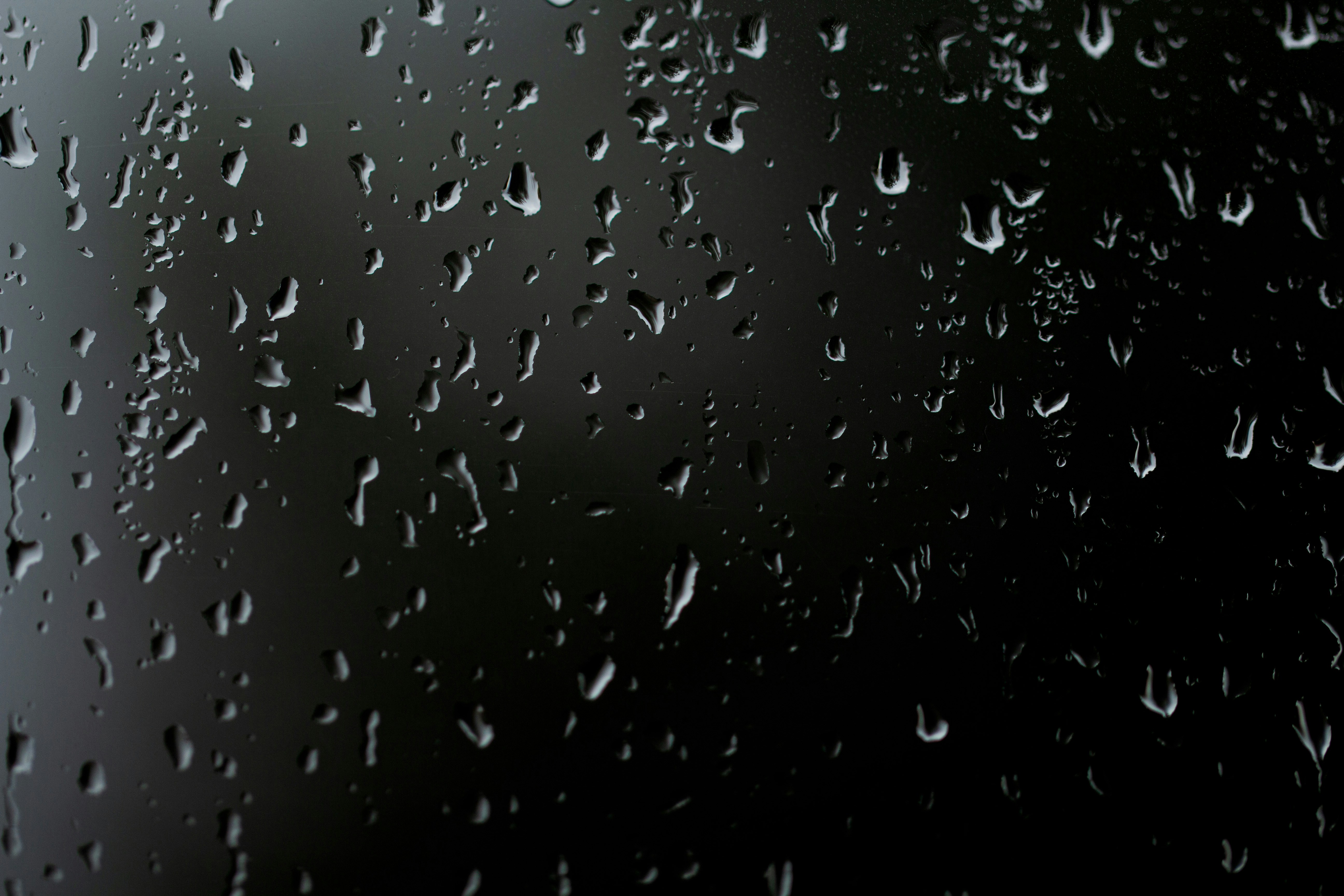 Rain drops on a window with a black background photo – Free Texture ...