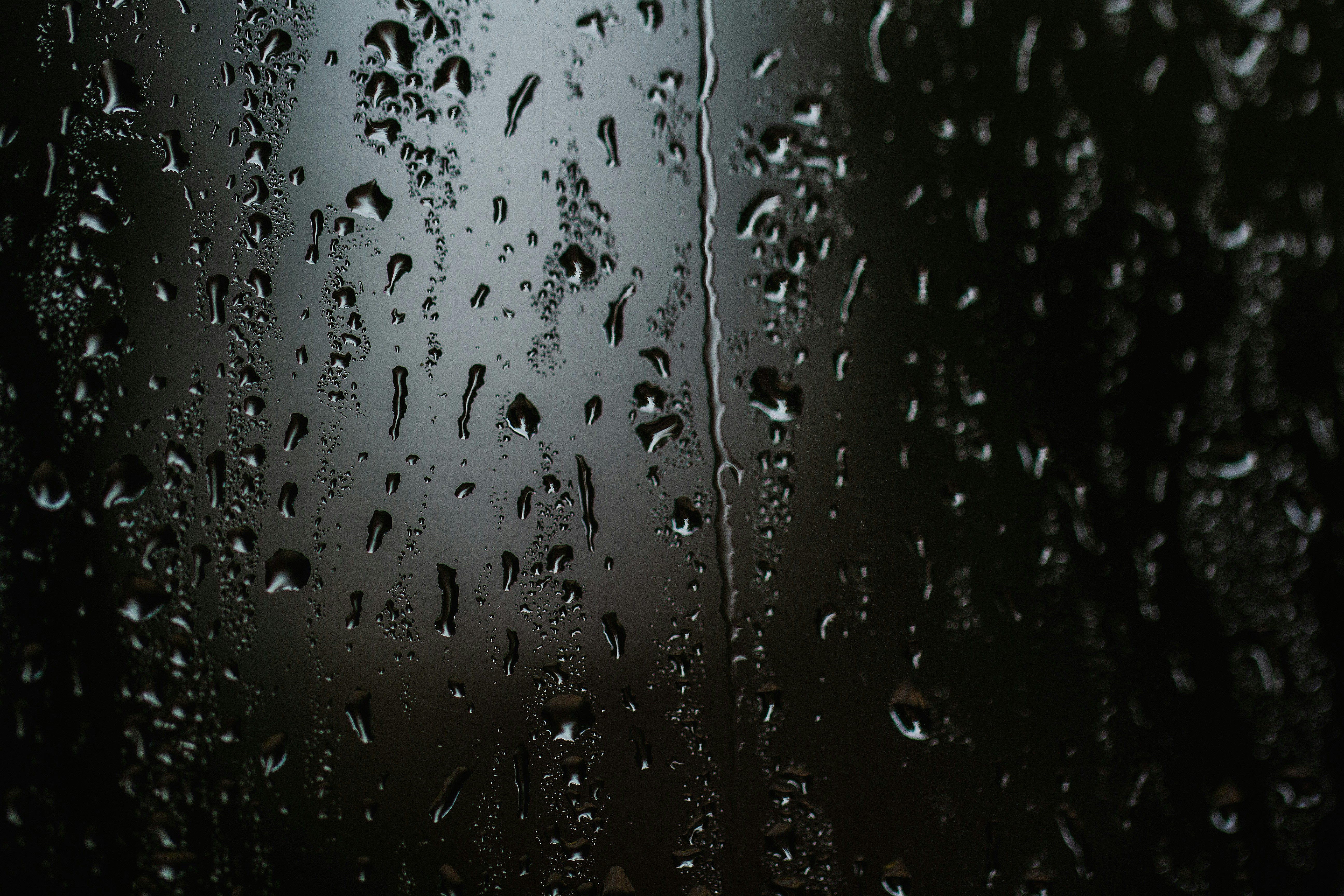 Rain drops on a window with a black background photo – Free Texture ...