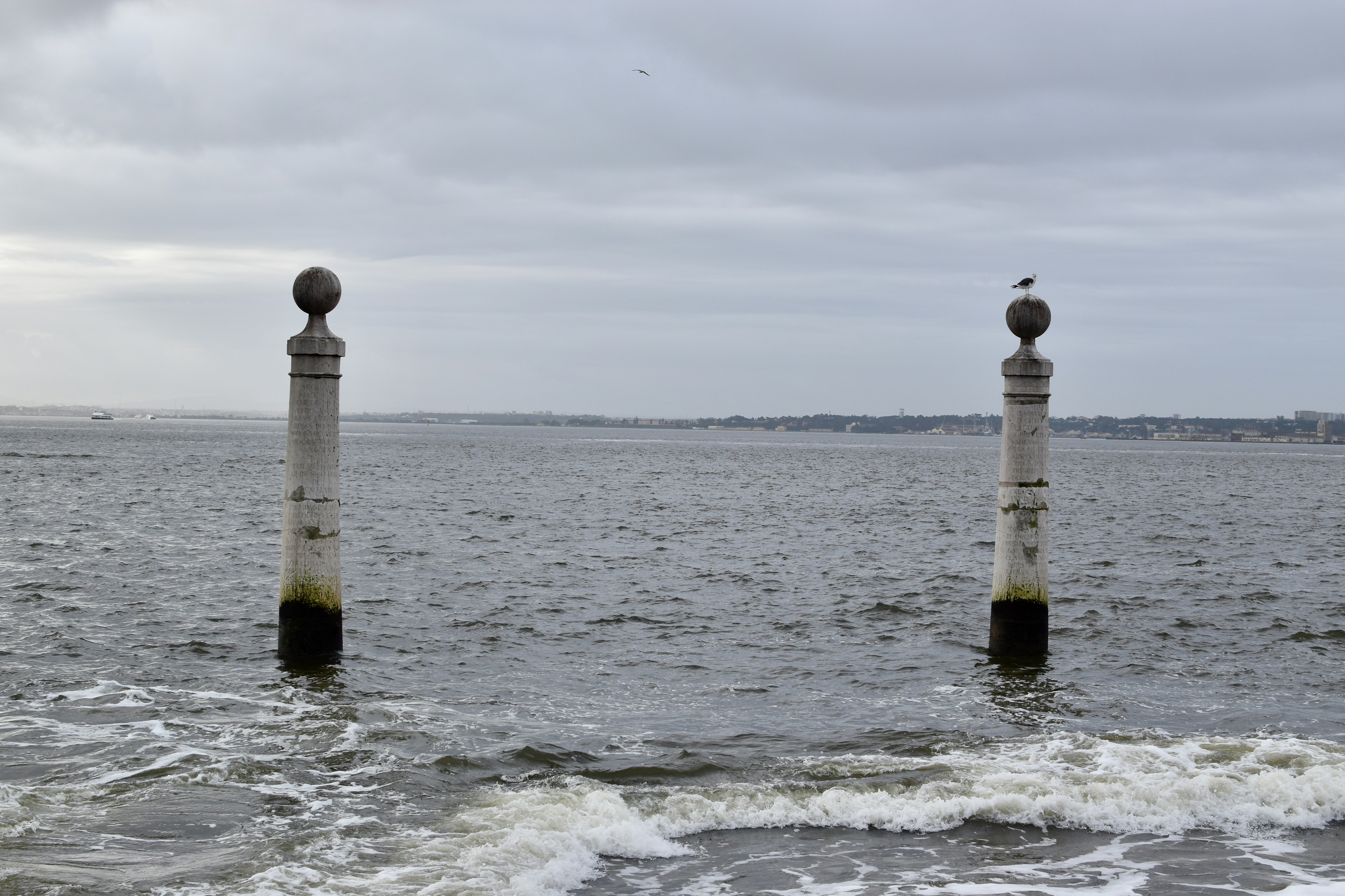 a couple of poles sticking out of the water