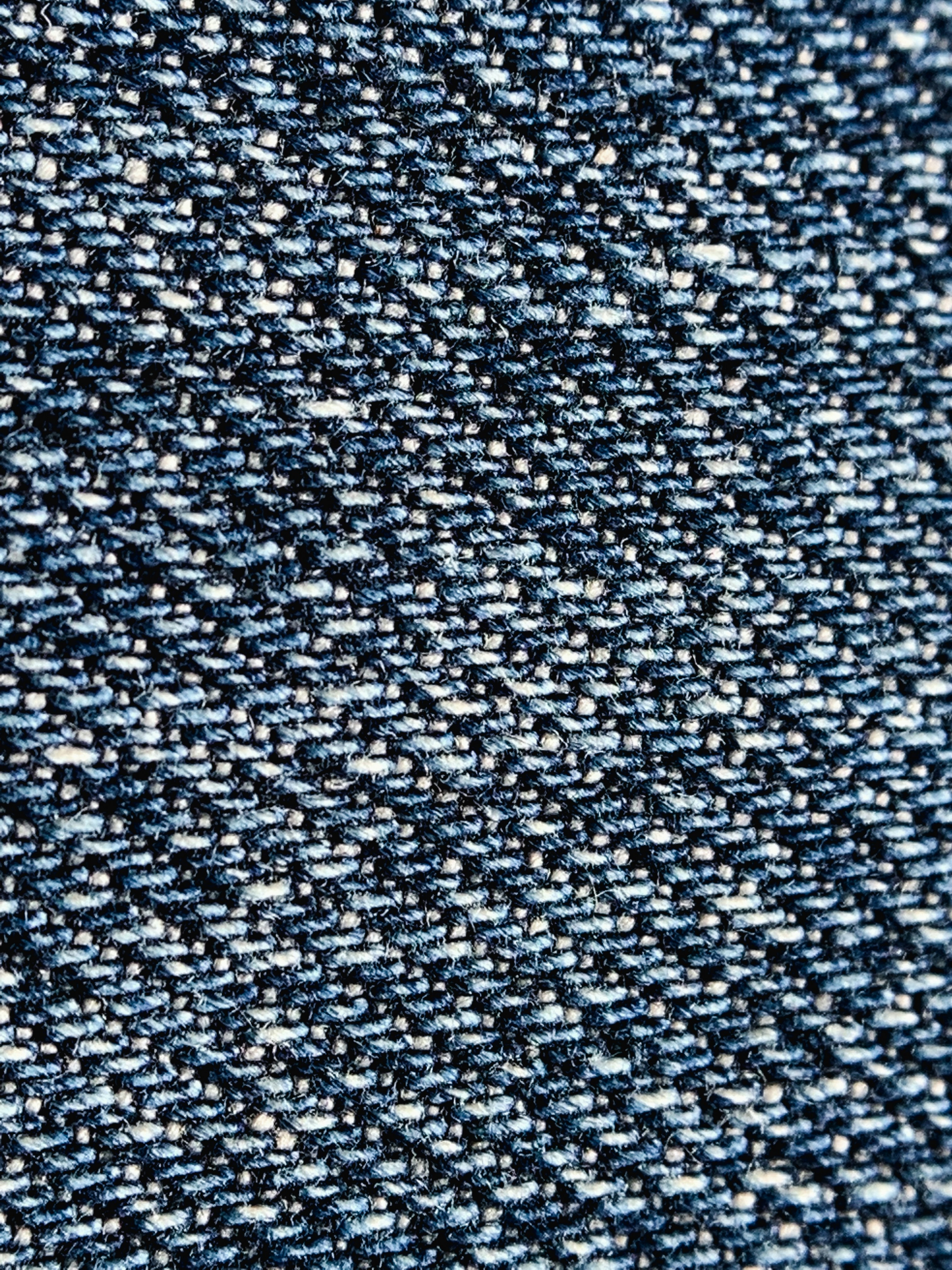 A close up of a blue and white tweed fabric photo – Free Pants Image on ...