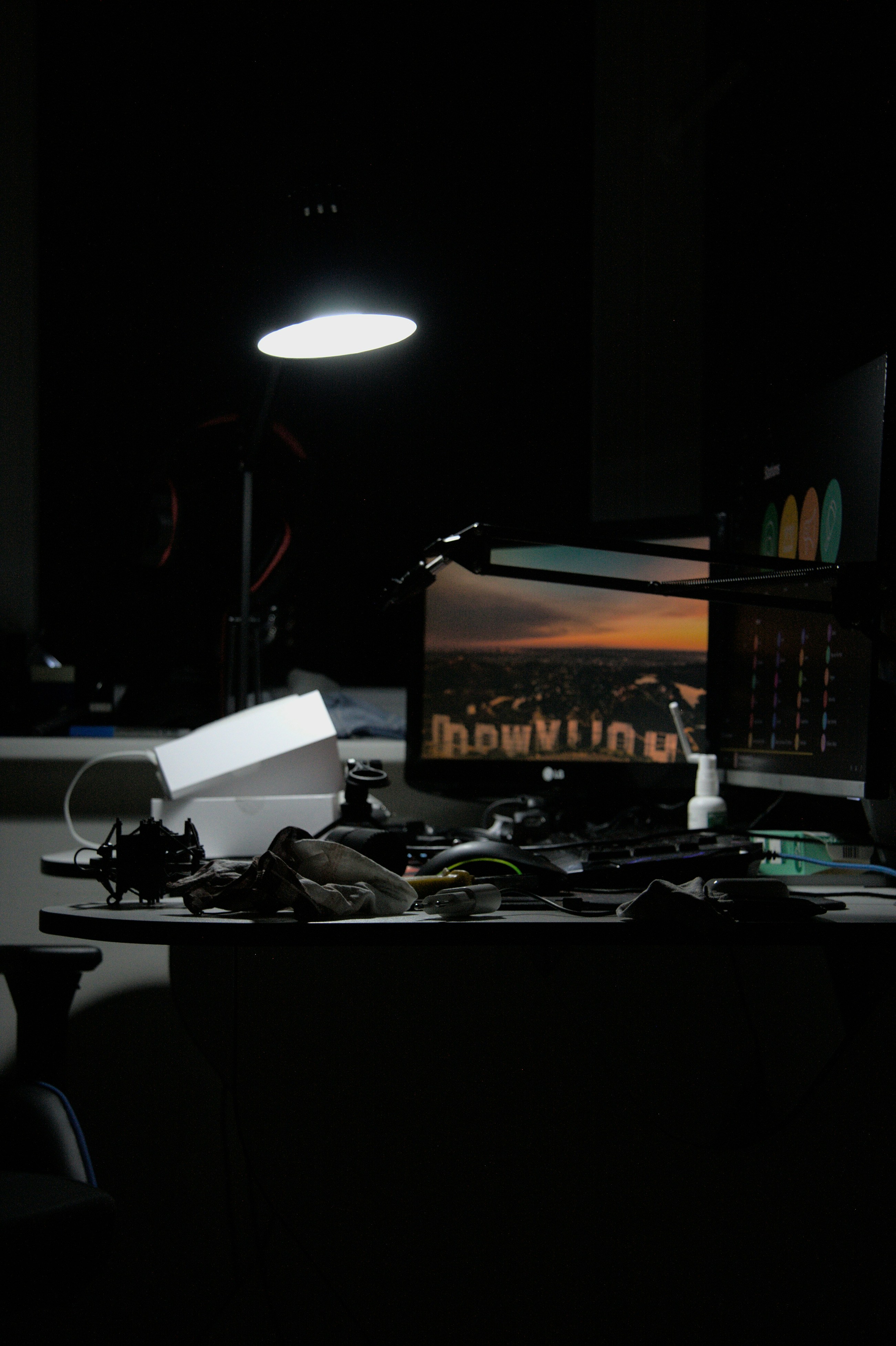 Halo Over a Cluttered Desk: City Lights on a Dim Night Shift