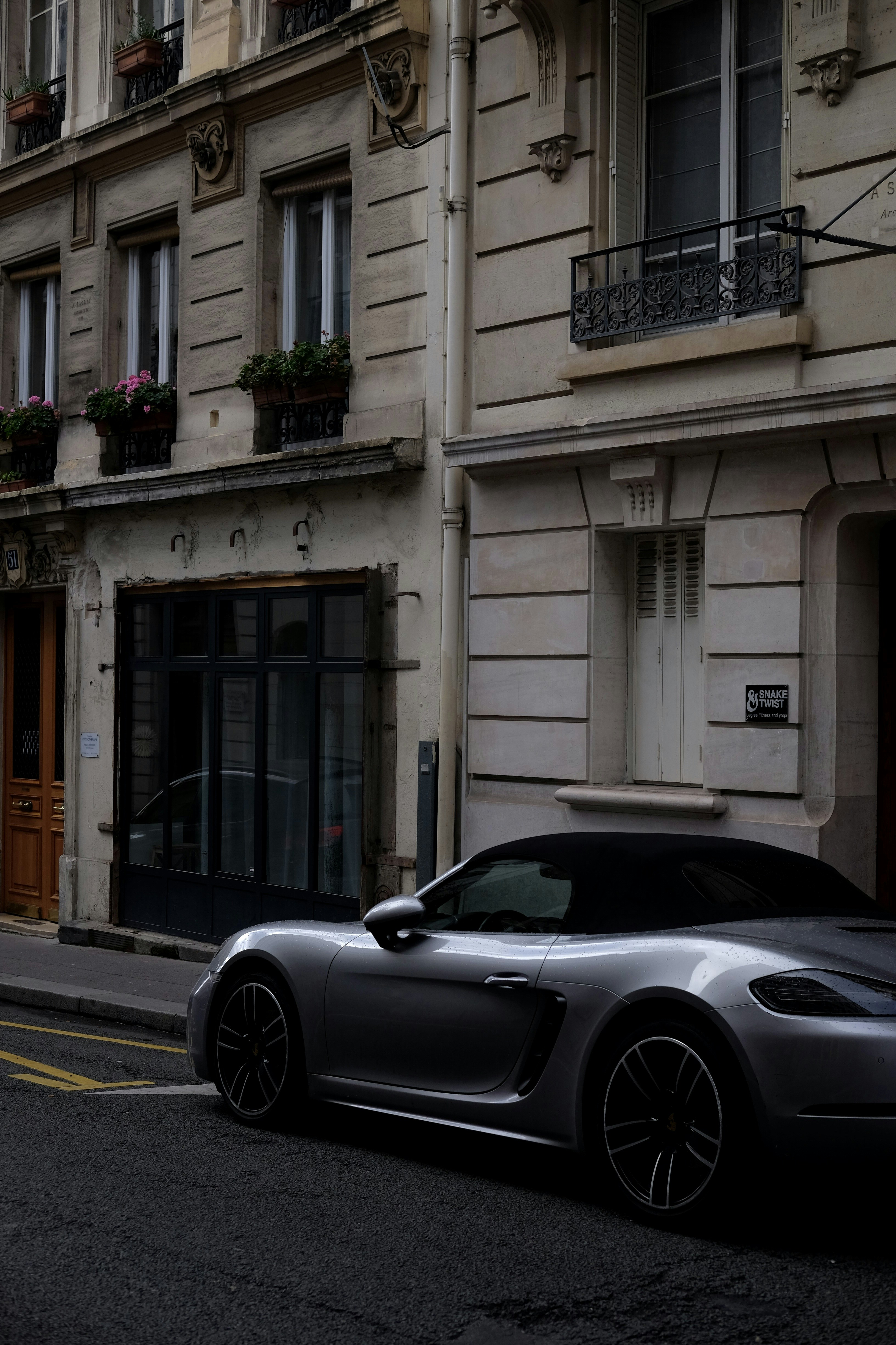 Silent Chrome: A Porsche on a Parisian Street at Dusk