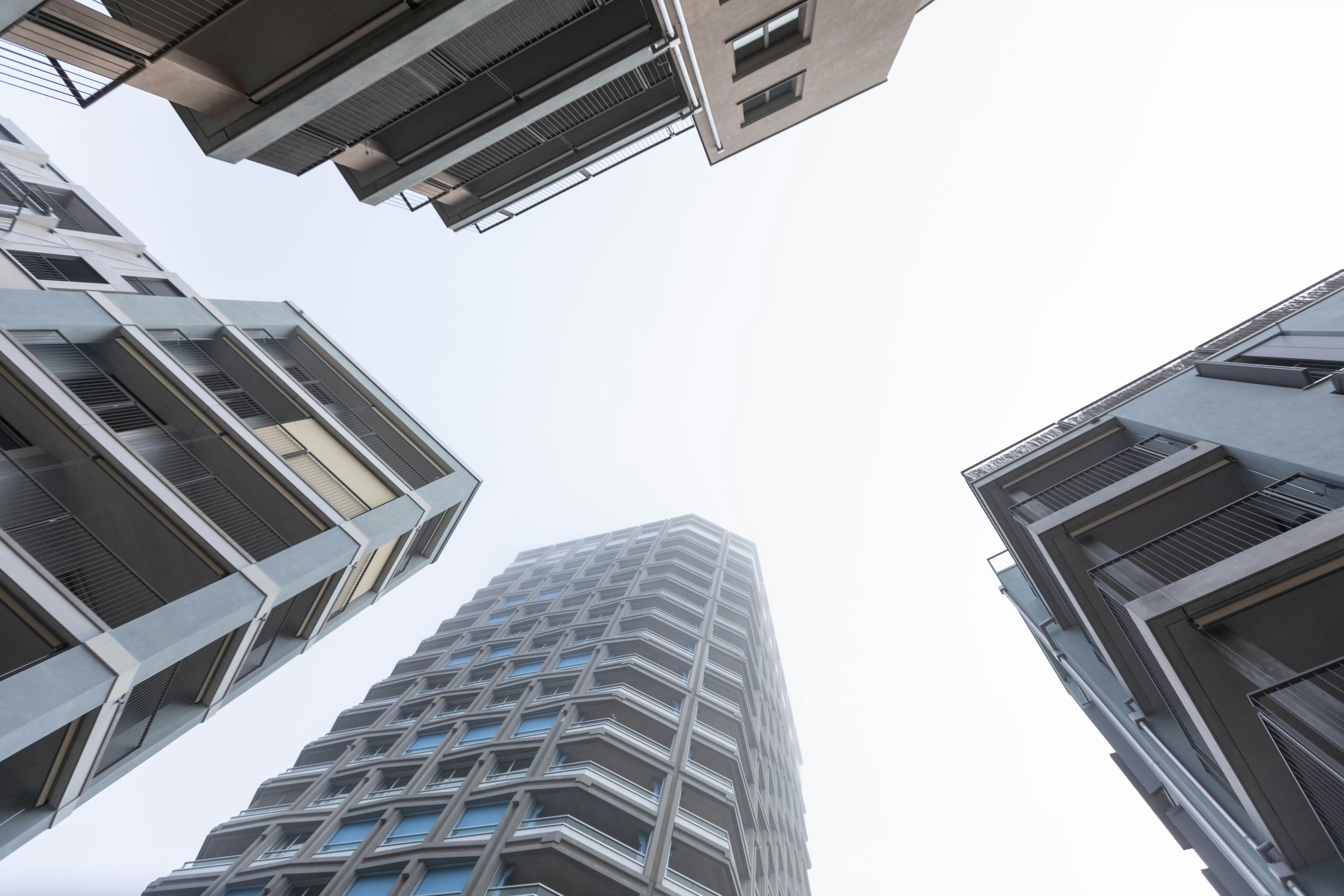 Looking up at tall buildings in a city photo – Free Building Image on ...