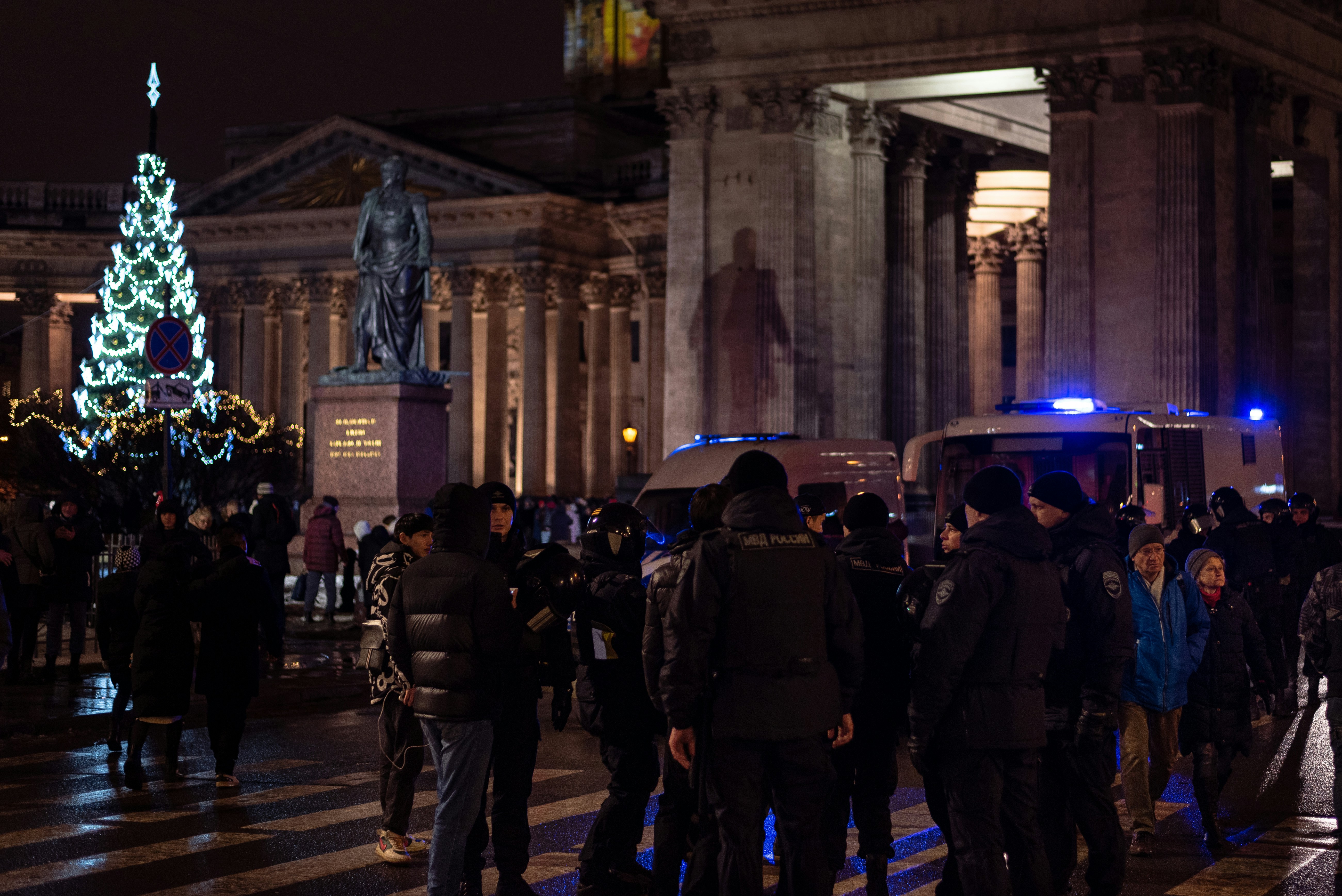 Midnight Vigil at the Neoclassical Plaza: Christmas Tree, Statue, and Patrol Lights
