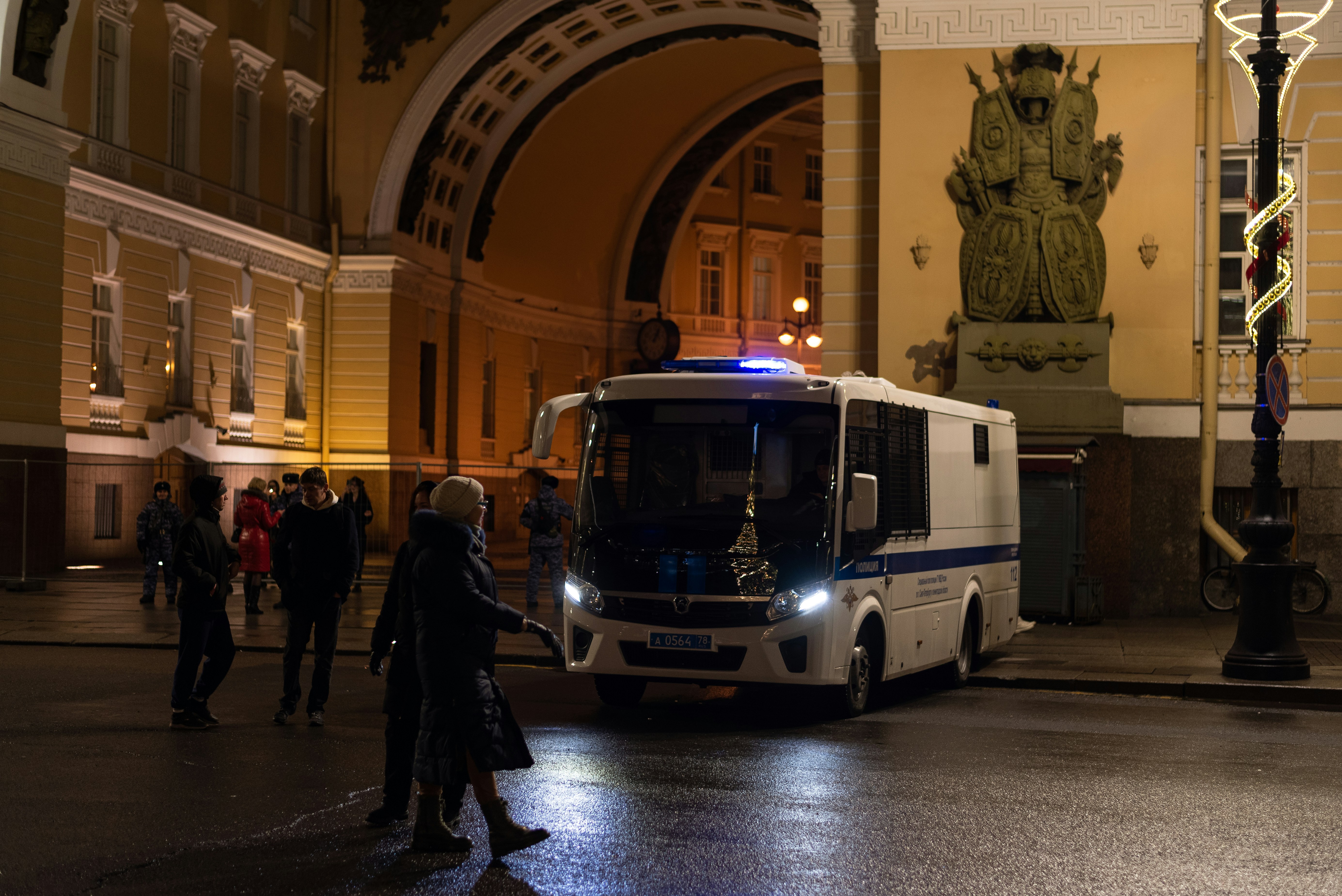 Night Bus Under the Grand Arch: Blue Lights in a Quiet City Square