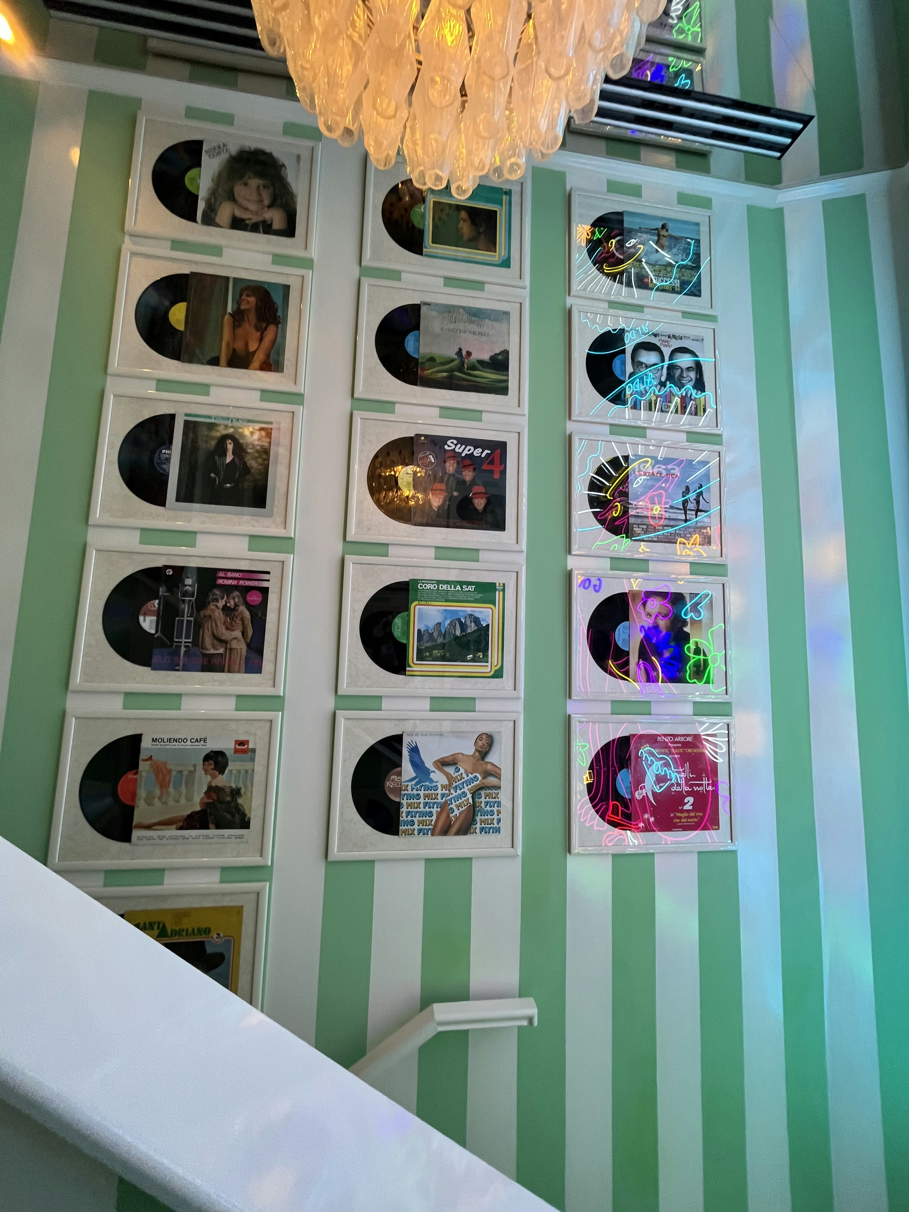 Mint Stripe Vinyl Gallery Beneath a Crystal Chandelier