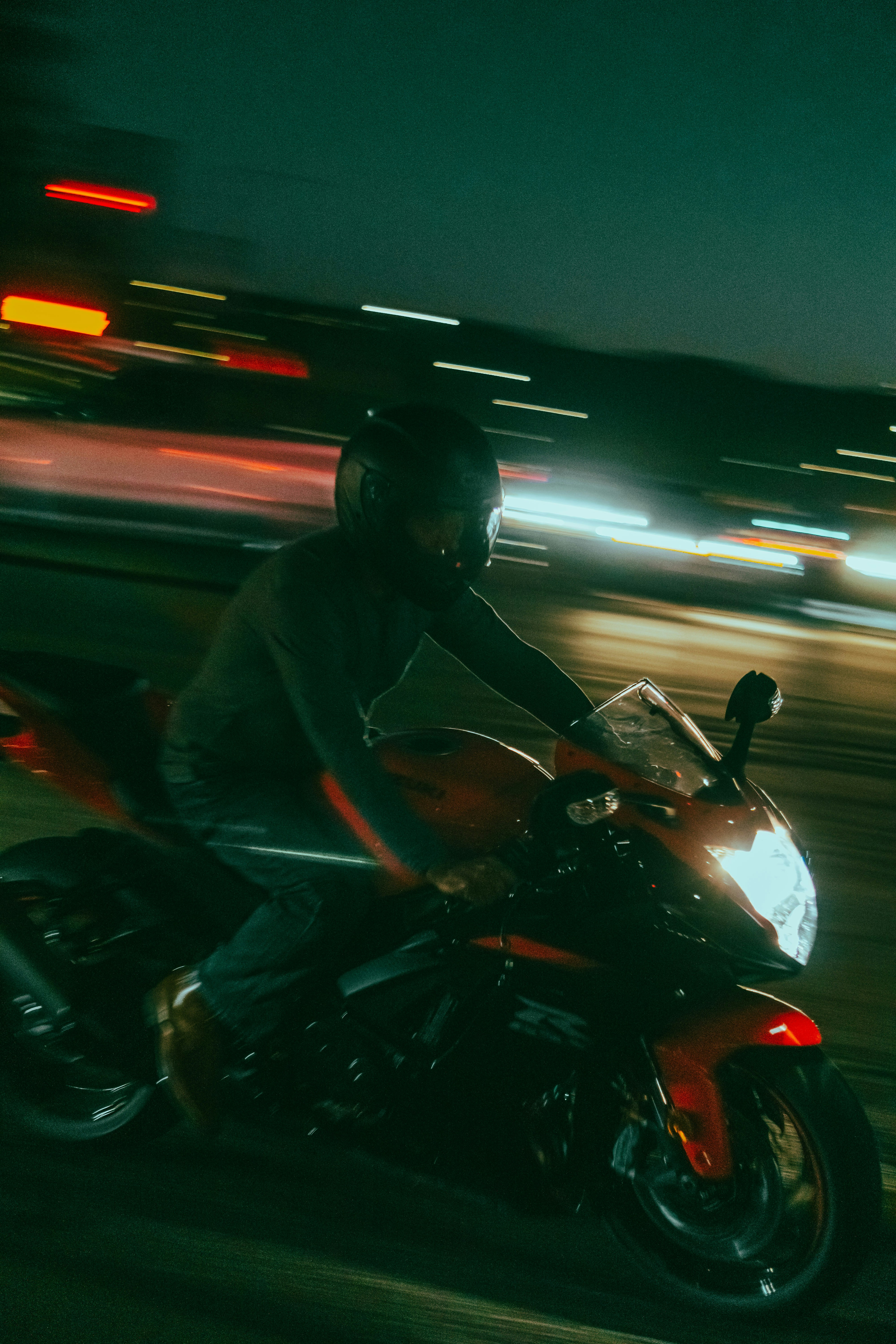 Midnight Blur: A Red Sportbike Cuts Through Neon Trails