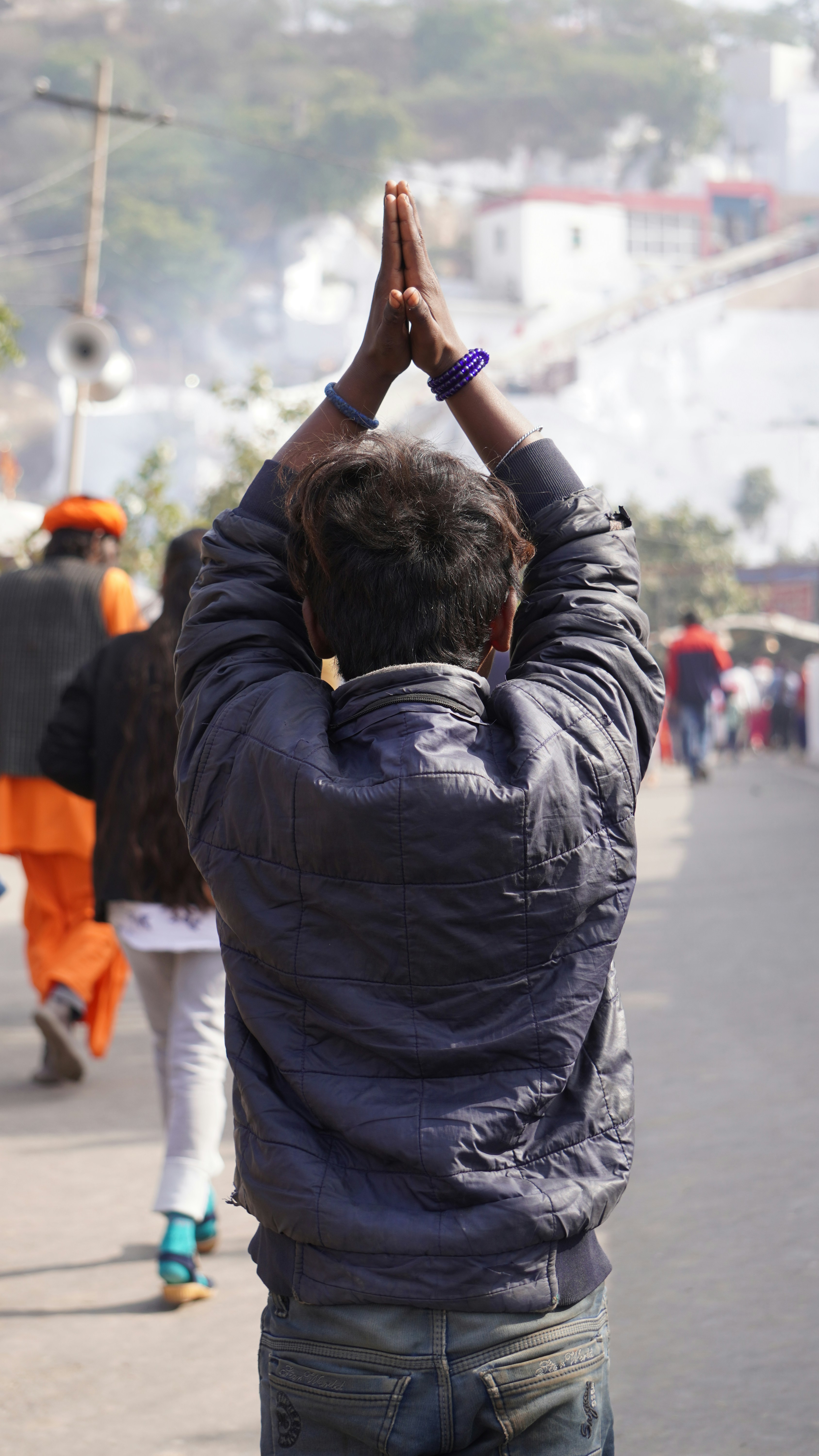 A Gesture of Reverence Amidst the Crowd