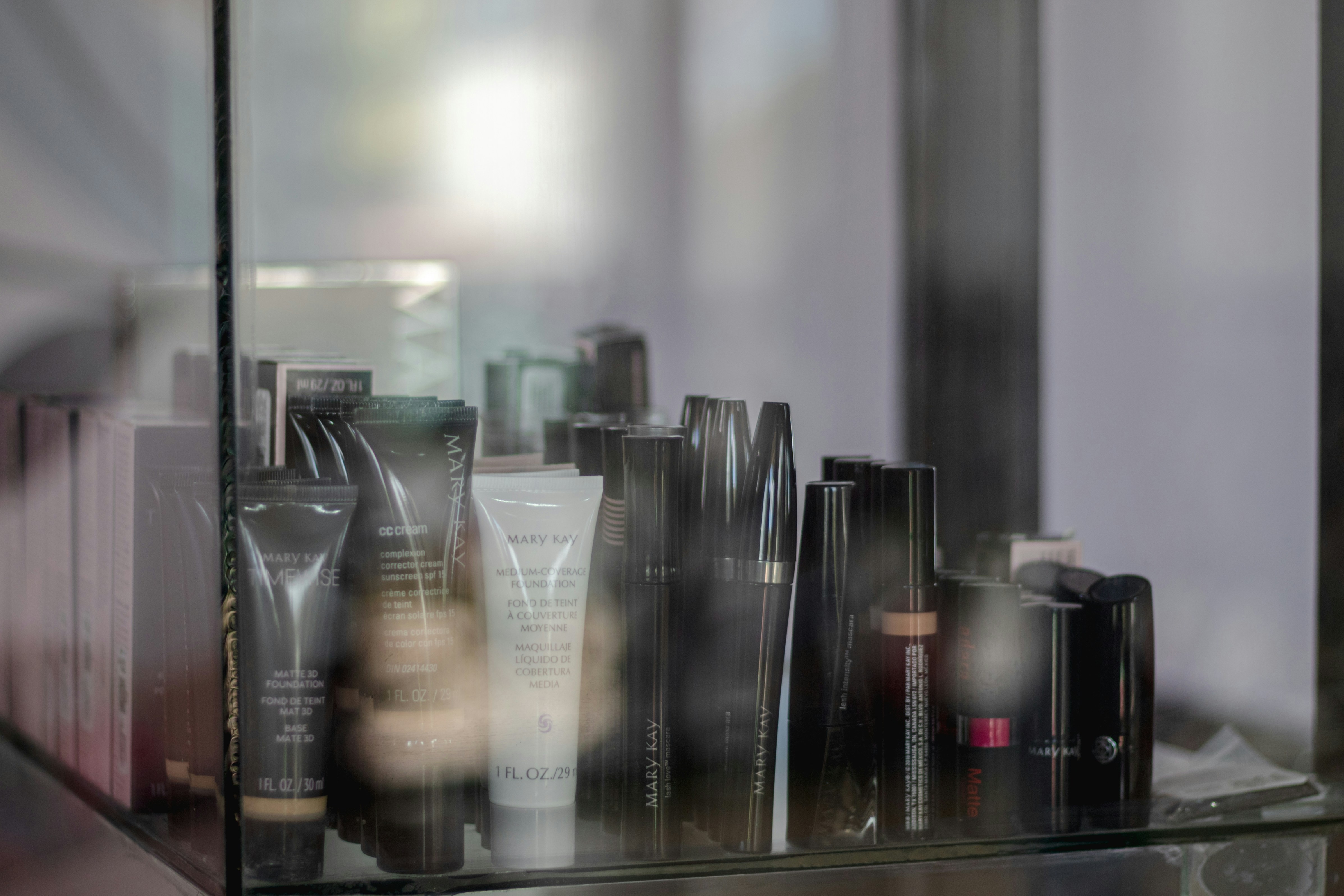 A shelf with a lot of different types of cosmetics photo – Free Beauty ...