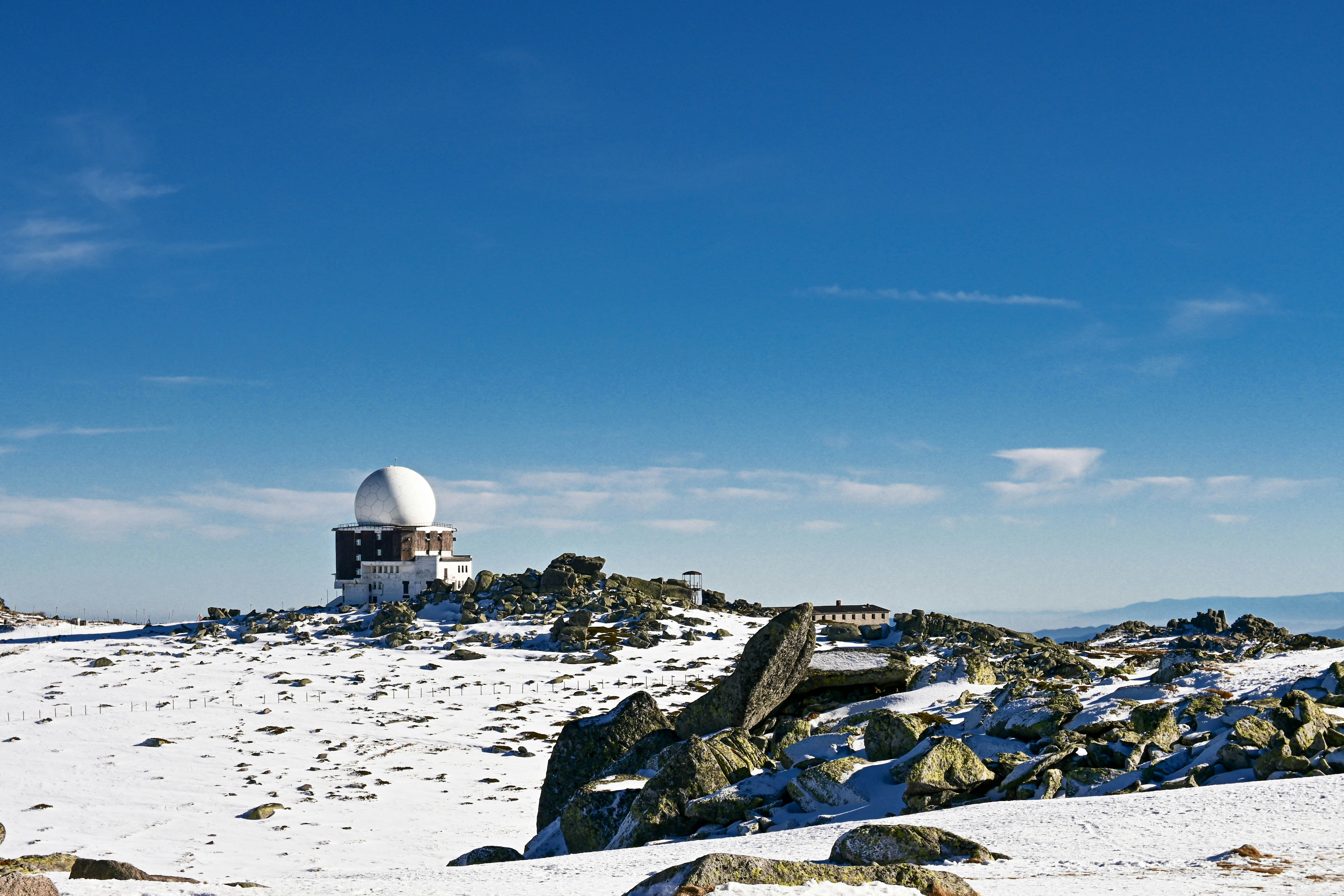 A satellite dish on top of a snowy hill photo – Free Winter Image on ...