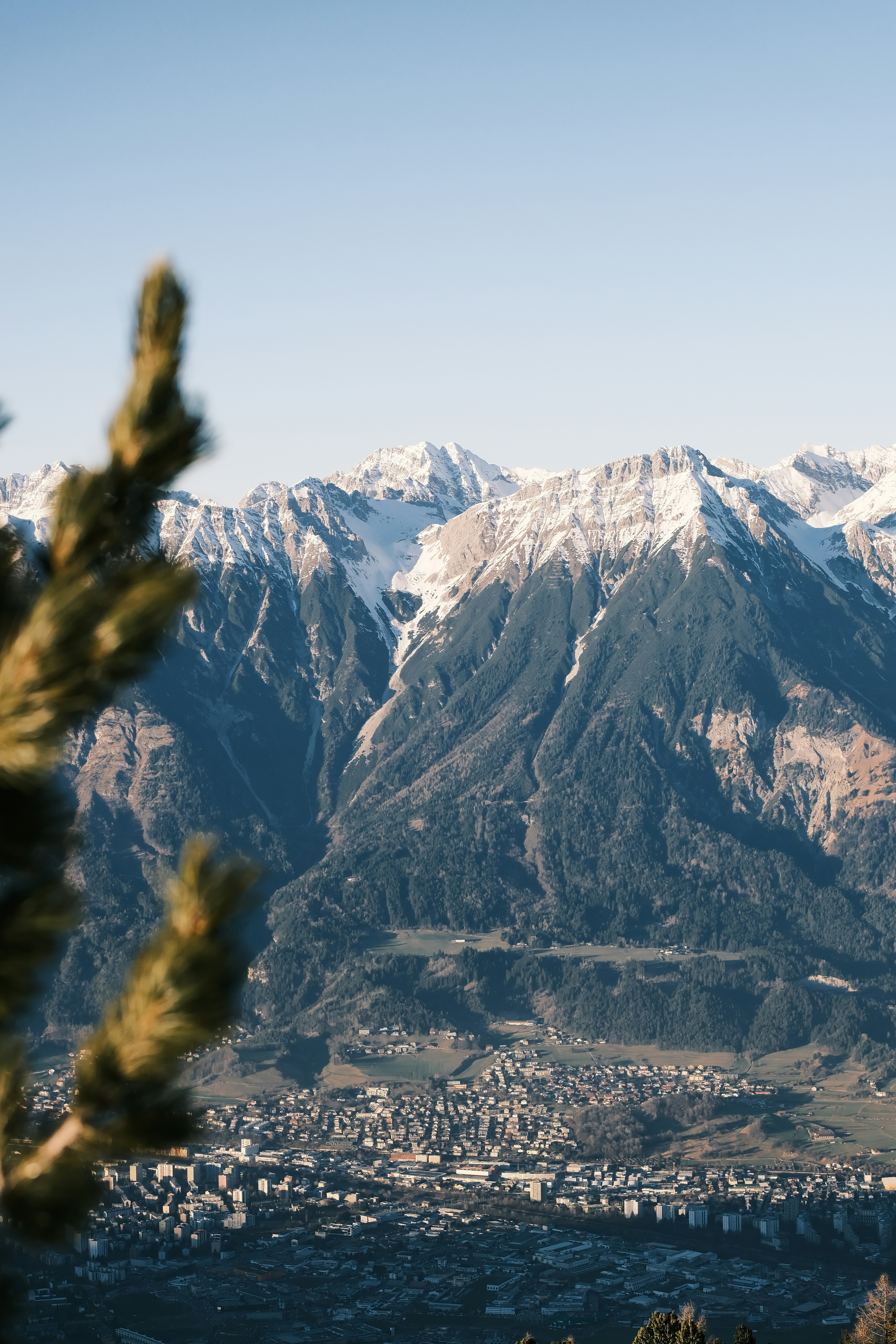 Snow-Crowned Giants Framing a Valley Town