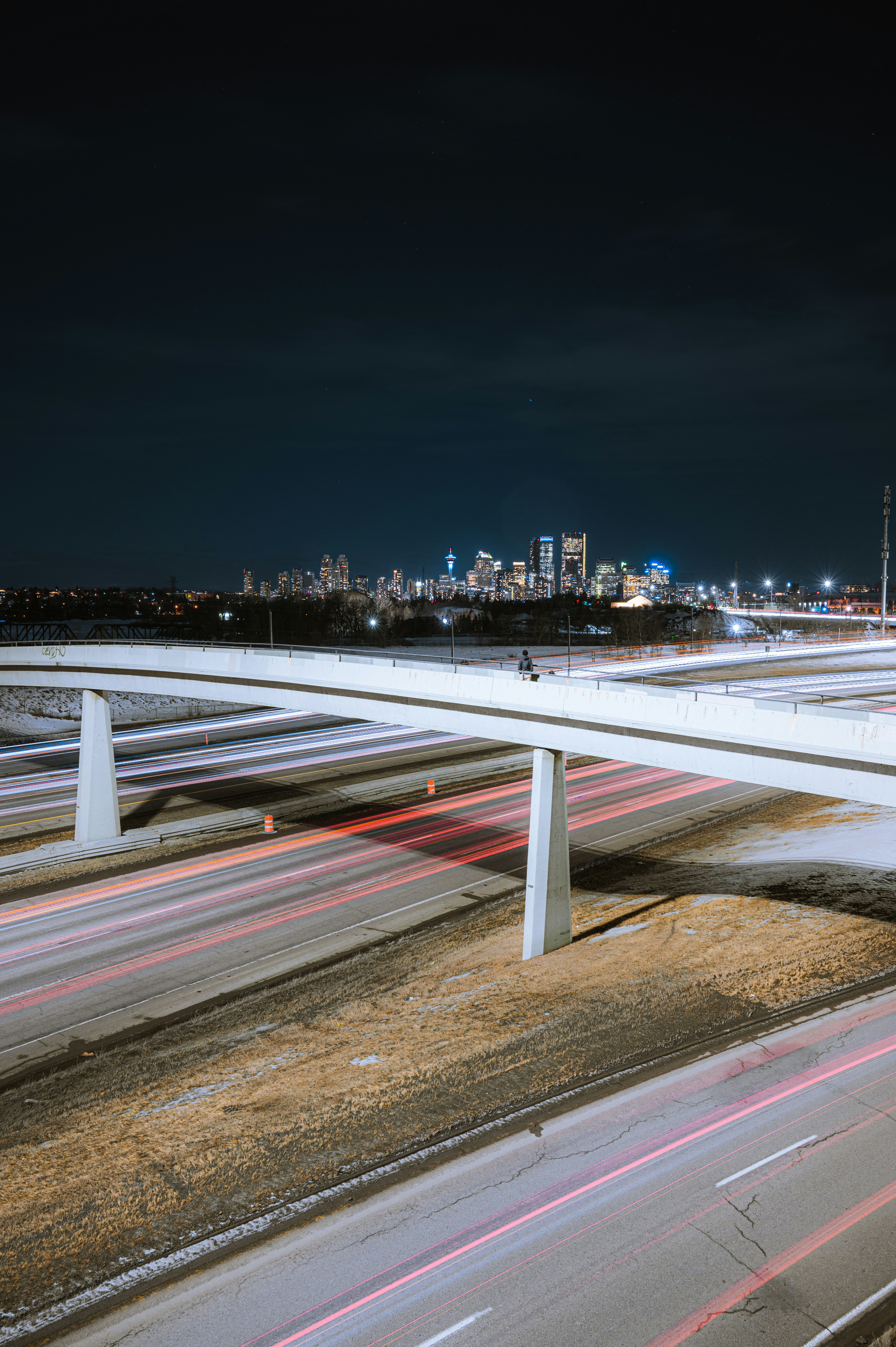 A freeway with a city skyline in the background photo – Free Canada ...