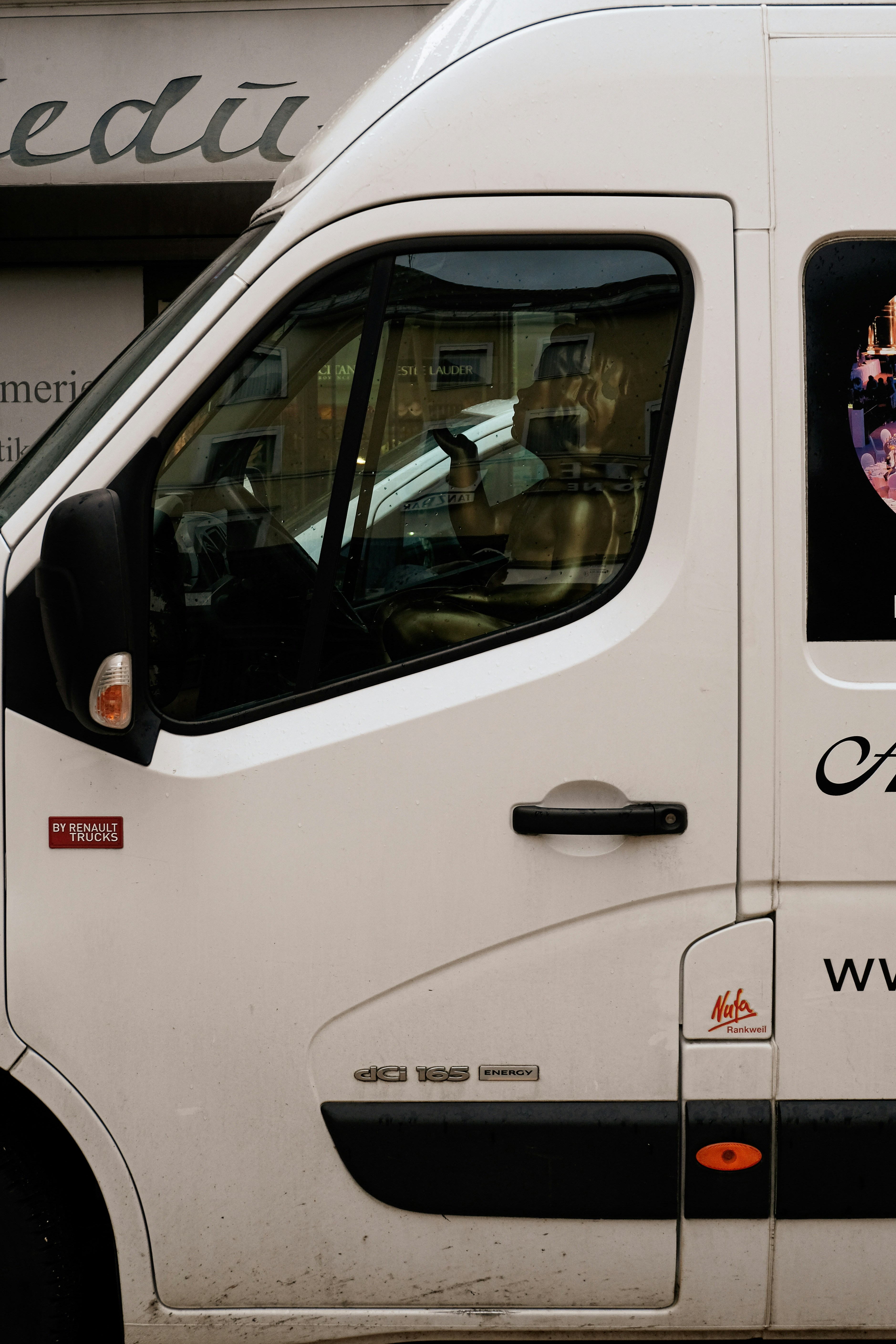 Cabin Reflections: Inside a White Delivery Van