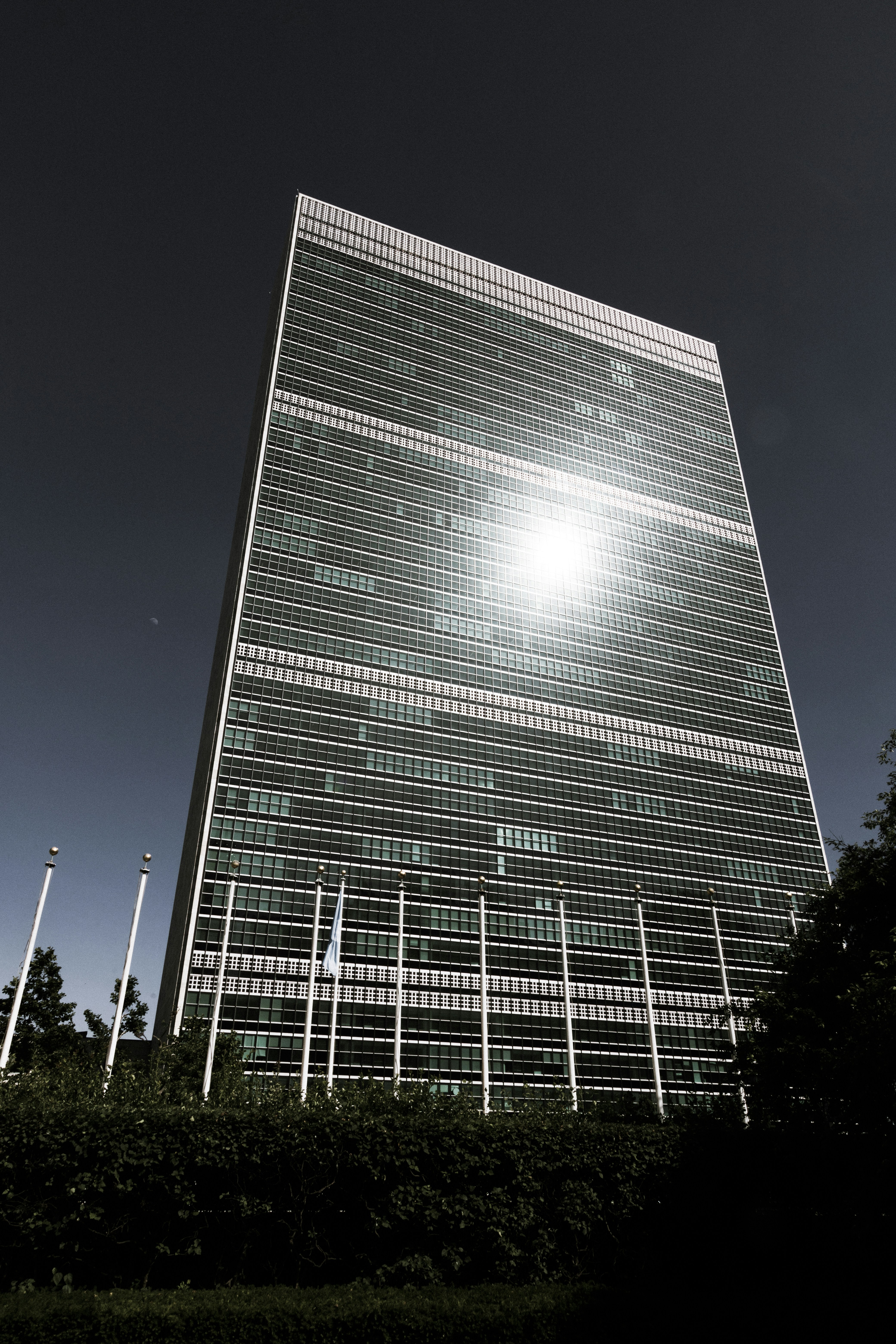 Sunburst on the Glass Tower: Reflections in a Blue Sky