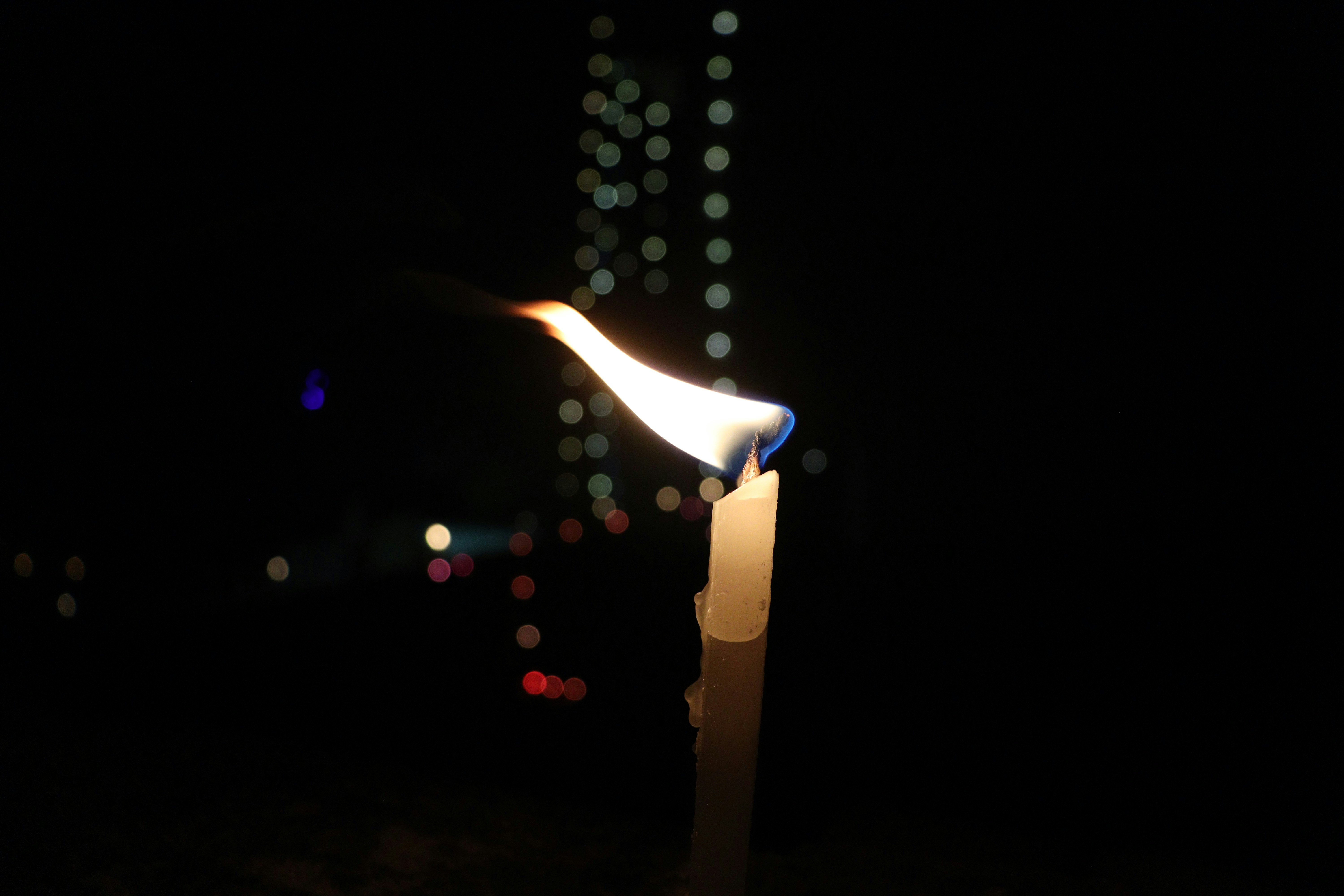 Blue-Tipped Candle Flame Against a Quiet Night