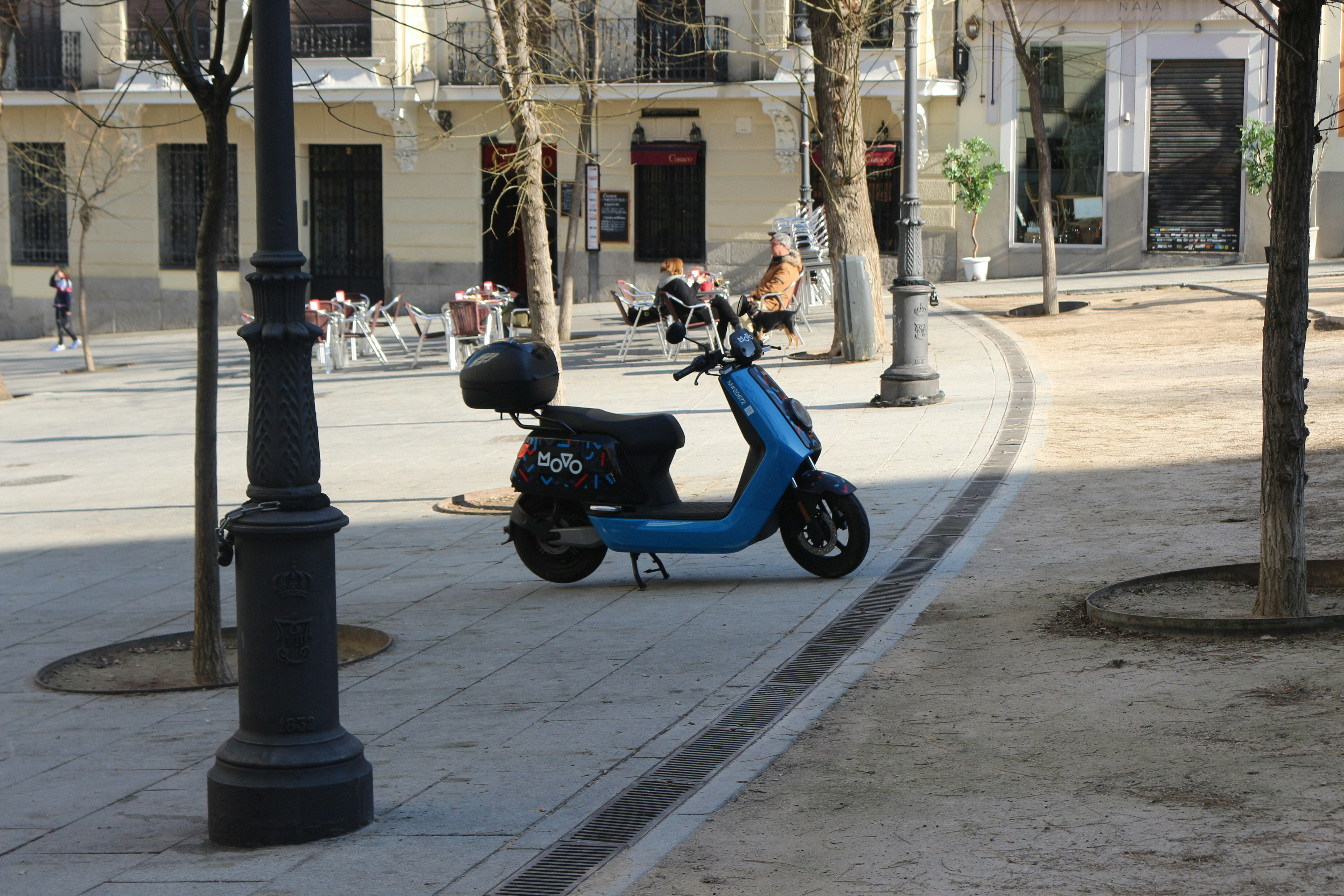 a scooter parked on the side of the road