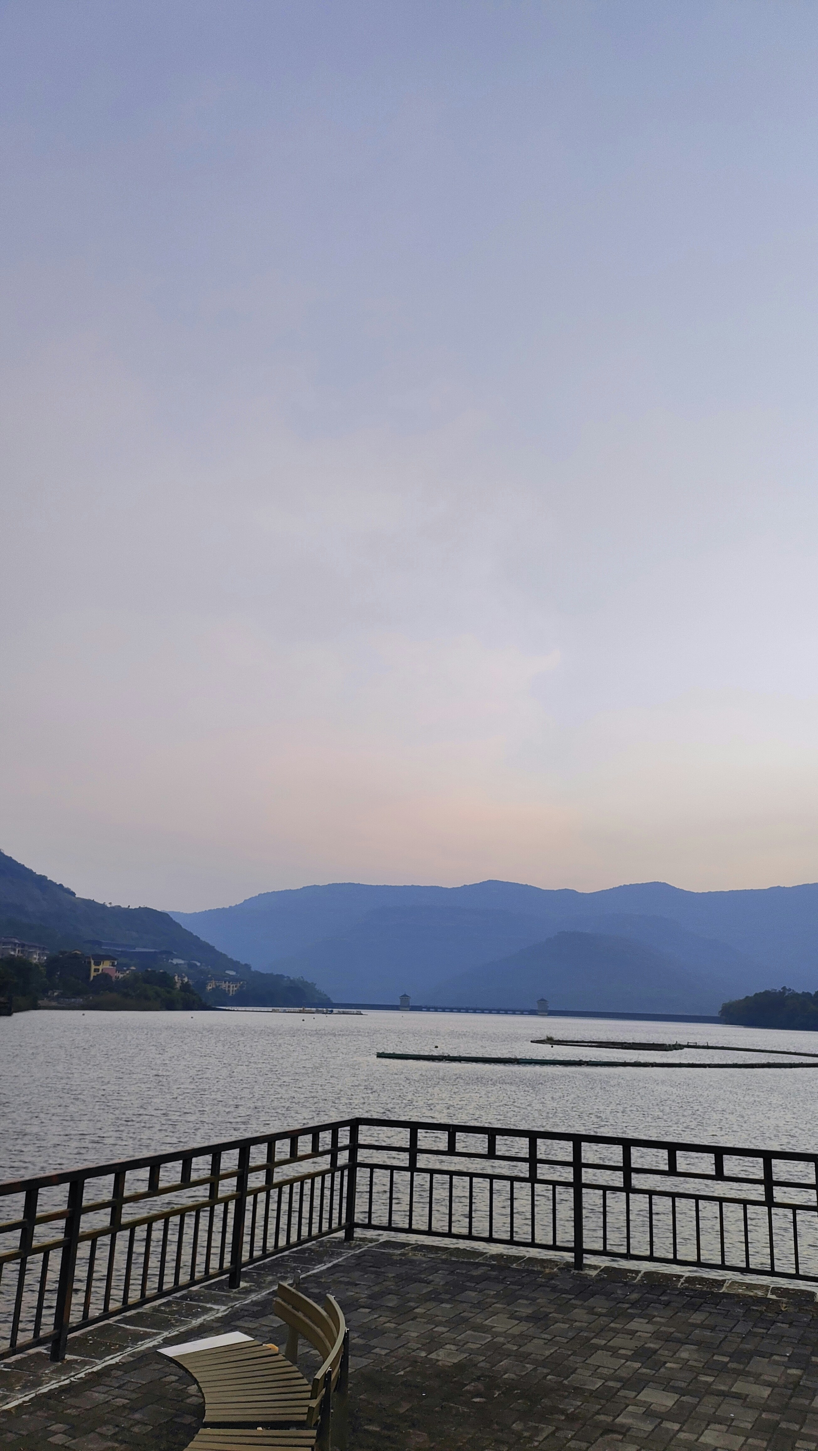 Sunset Terrace Overlooking Misty Hills and Calm Lake