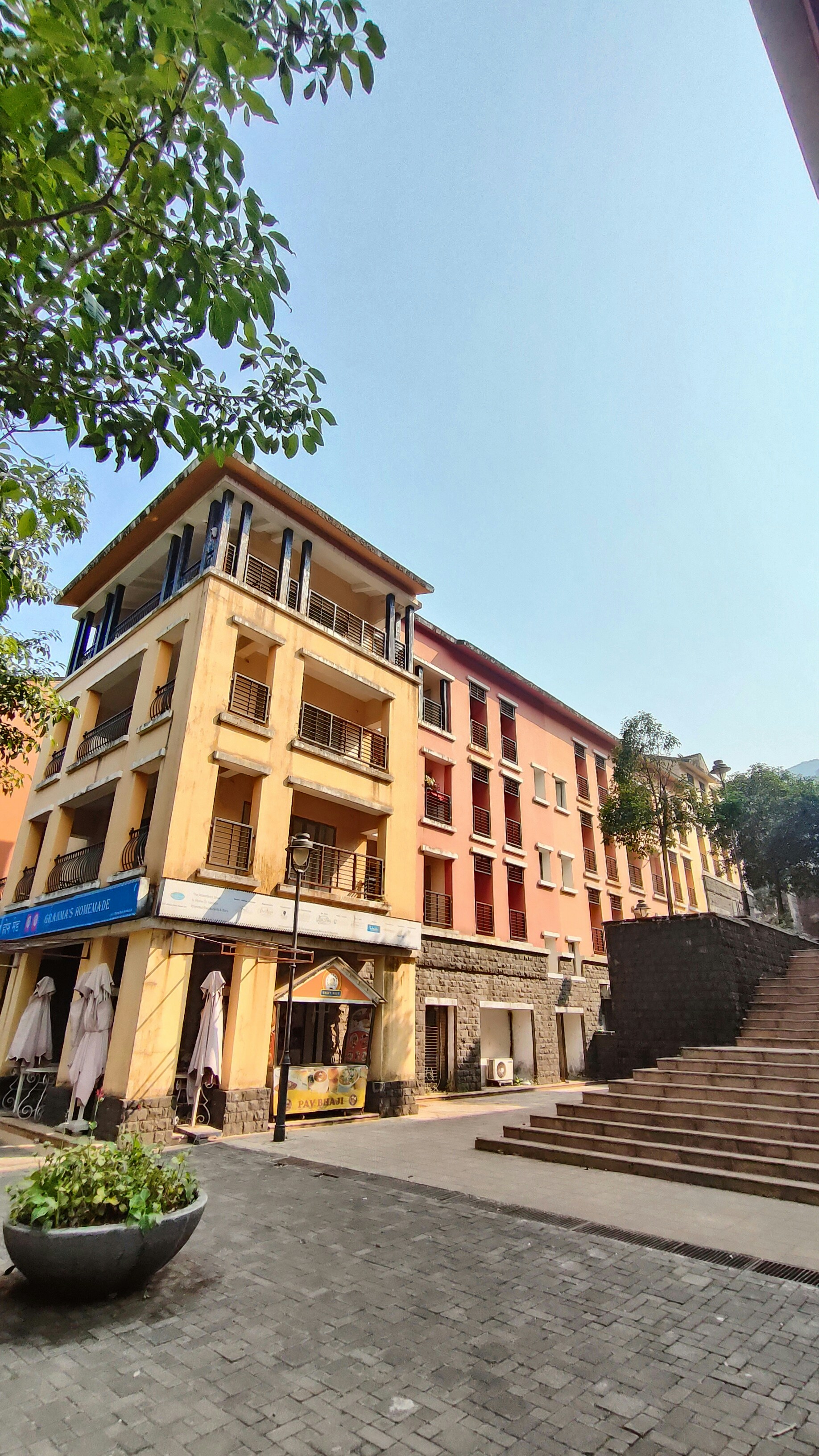 Amber Facades and Granite Steps: A Sunlit Street Composition