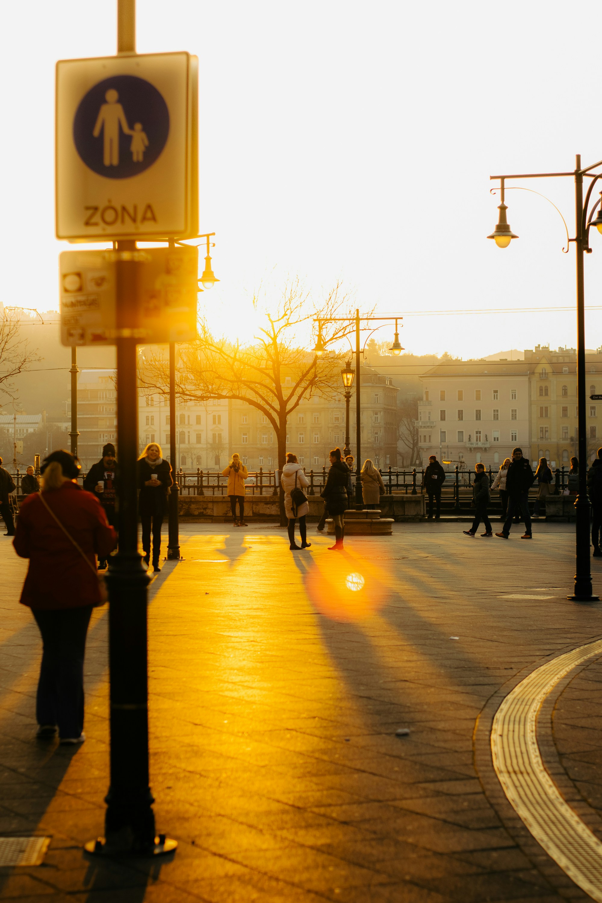 Golden Hour Pedestrian Plaza: Sunlight, Shadows, and Signage