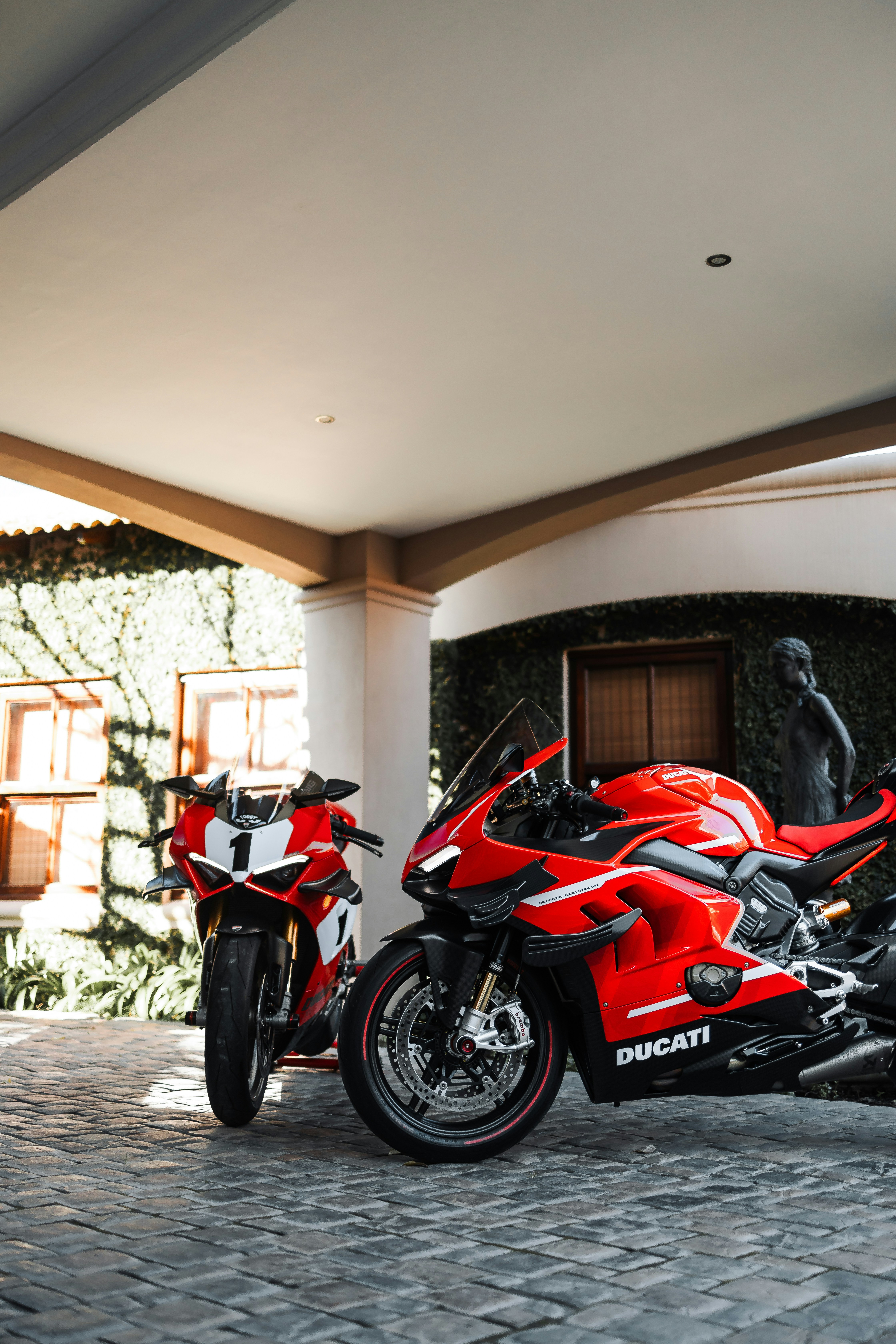 A red motorcycle parked in front of a building photo – Free Somerset ...