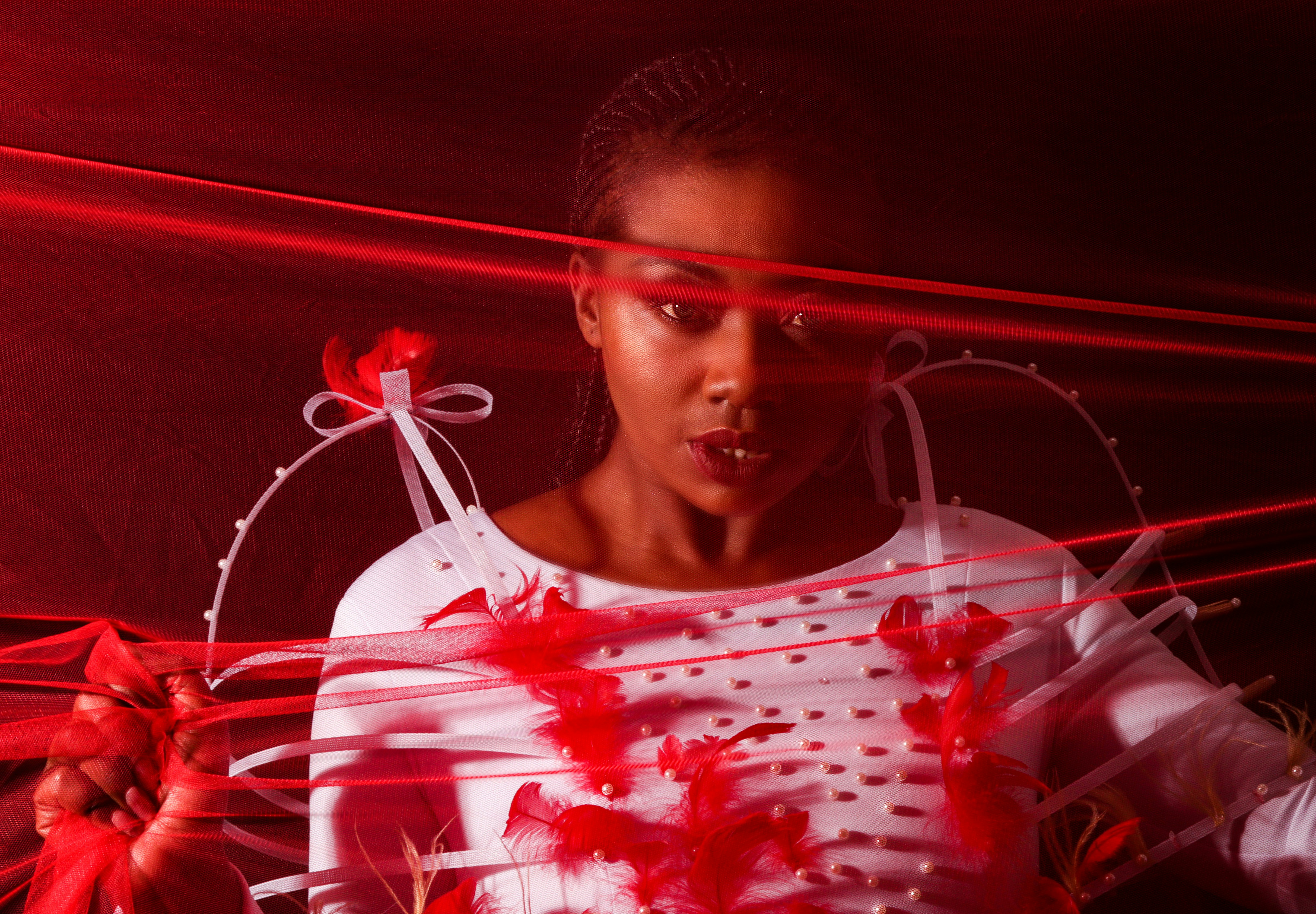 Red Veil: A Portrait Wrapped in Streaks of Light