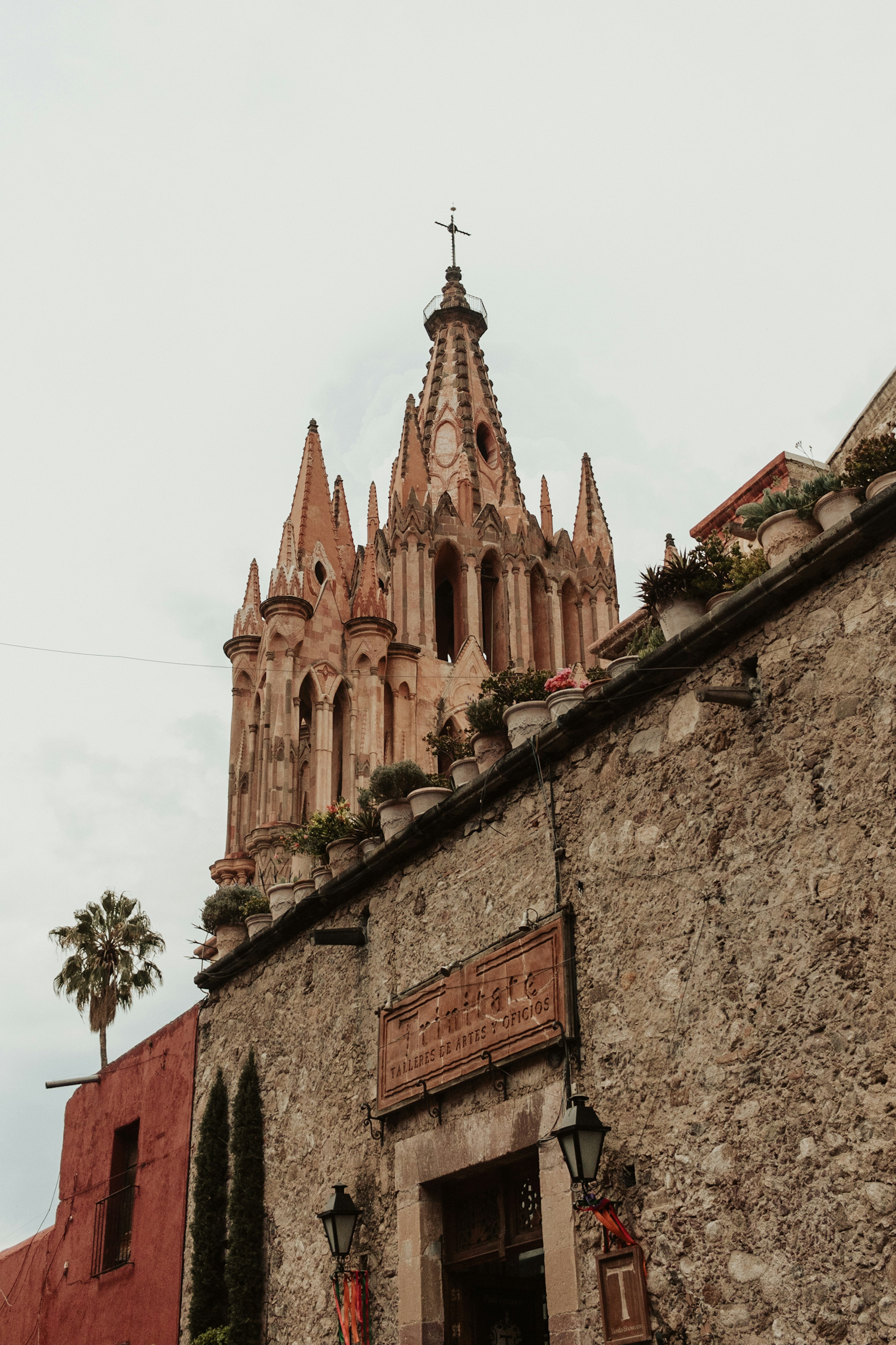 Spires Above the Terraced Stone: A Cathedral Curtain Over a Rustic Calle