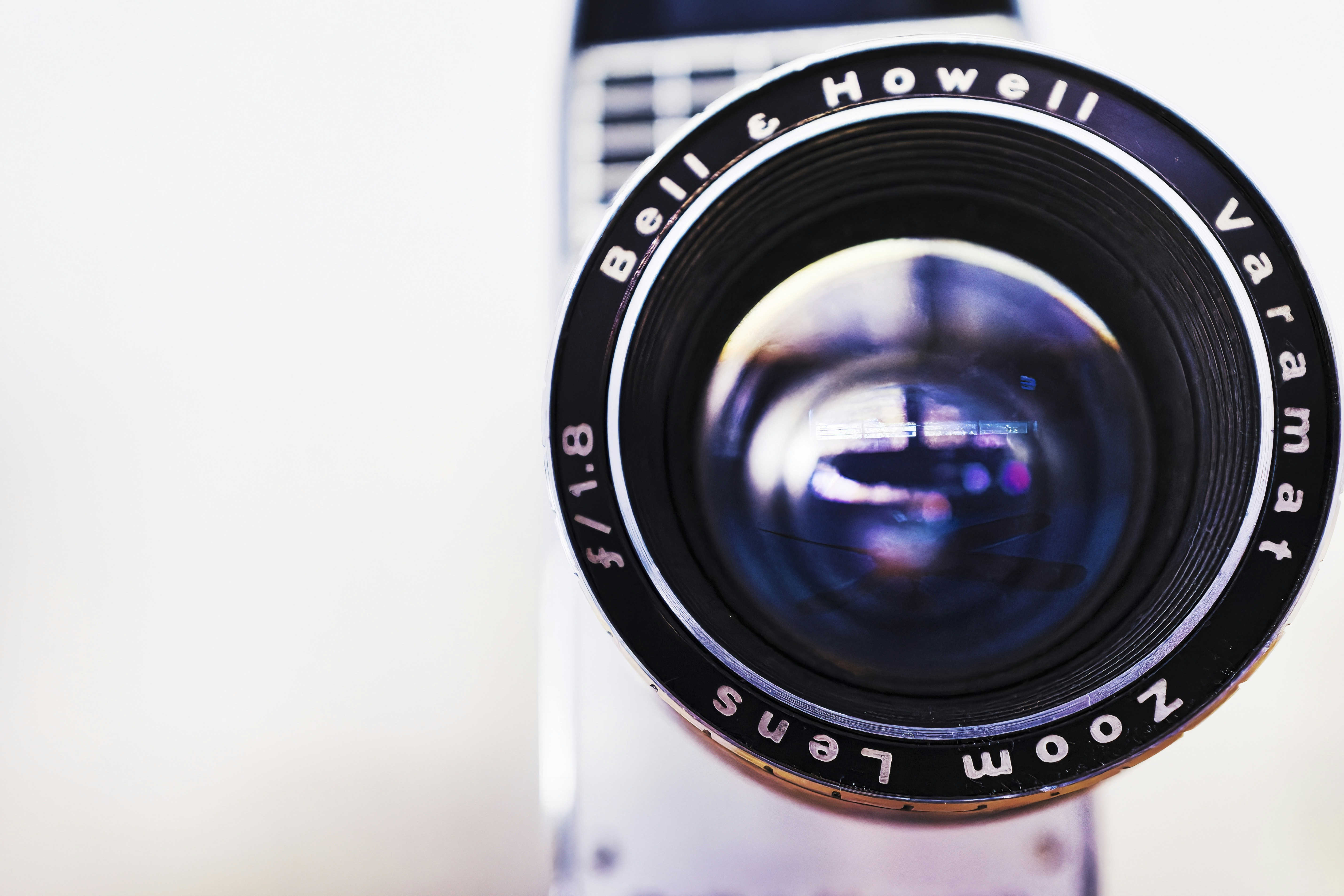 Metallic Focus: Close-Up of a Vintage Lens with Prism-Like Reflections