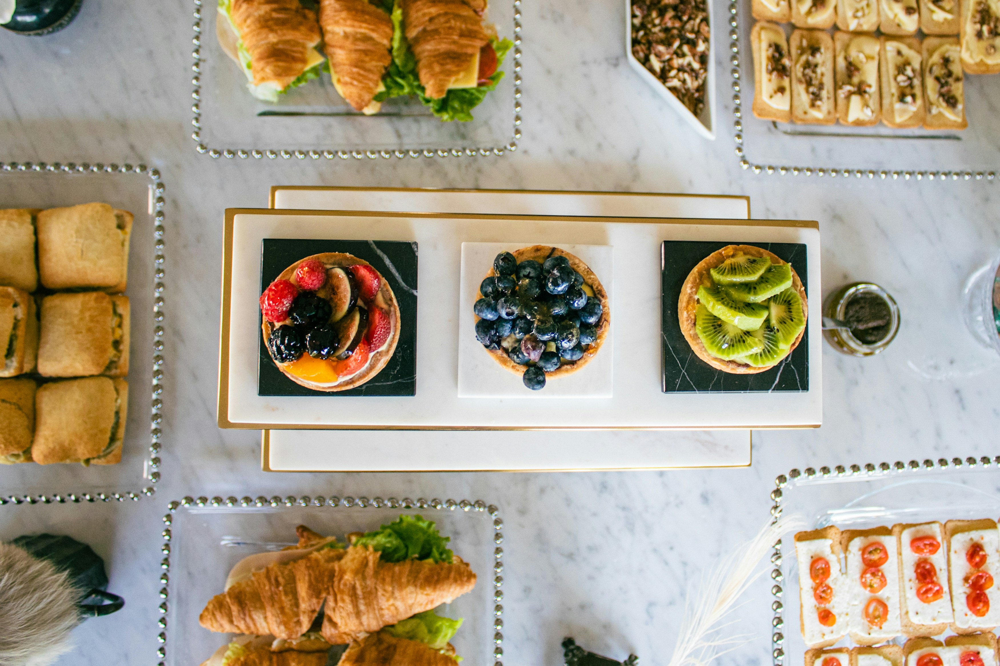 A table topped with lots of different types of food photo – Free Brunch ...