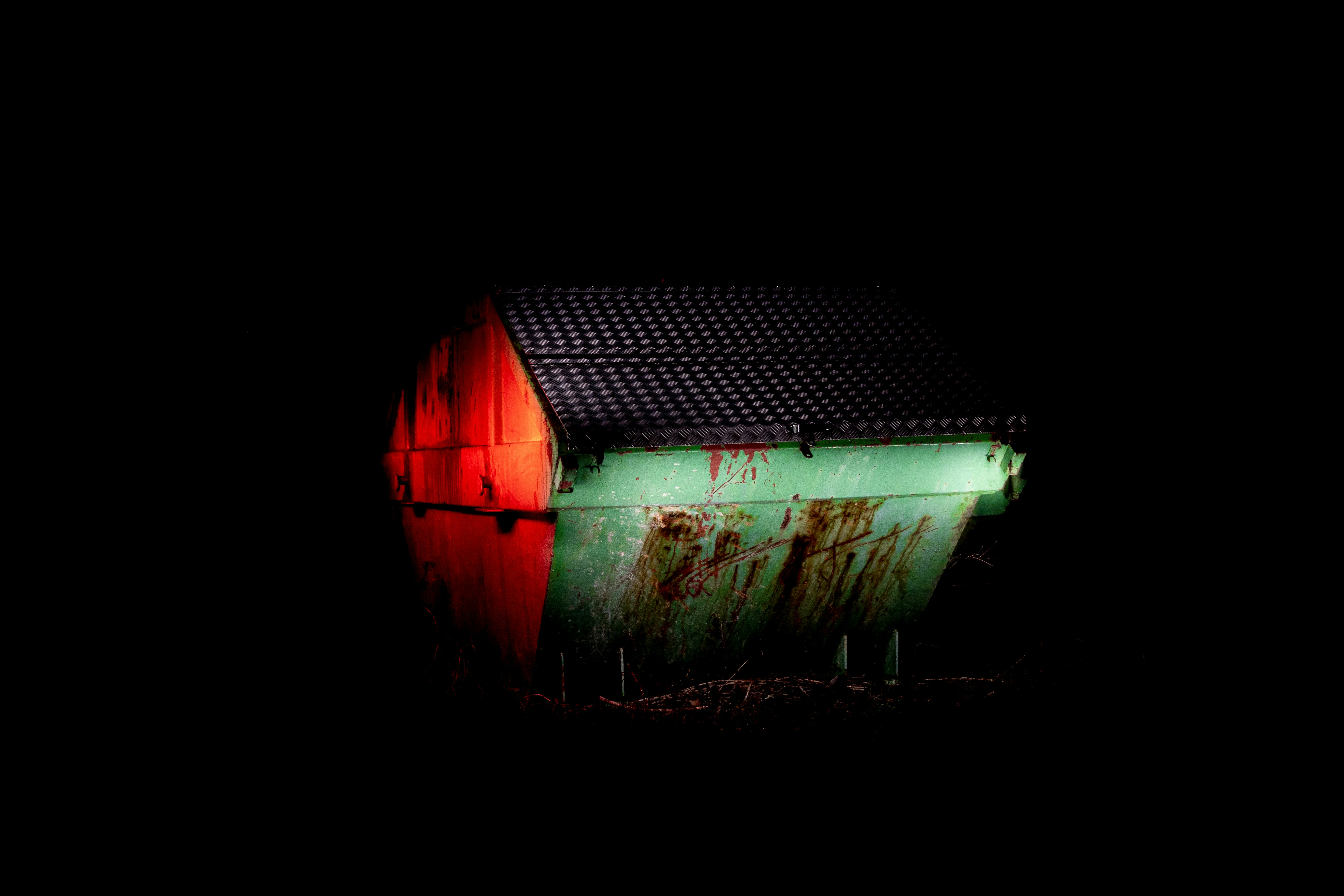 a red and green building in the dark