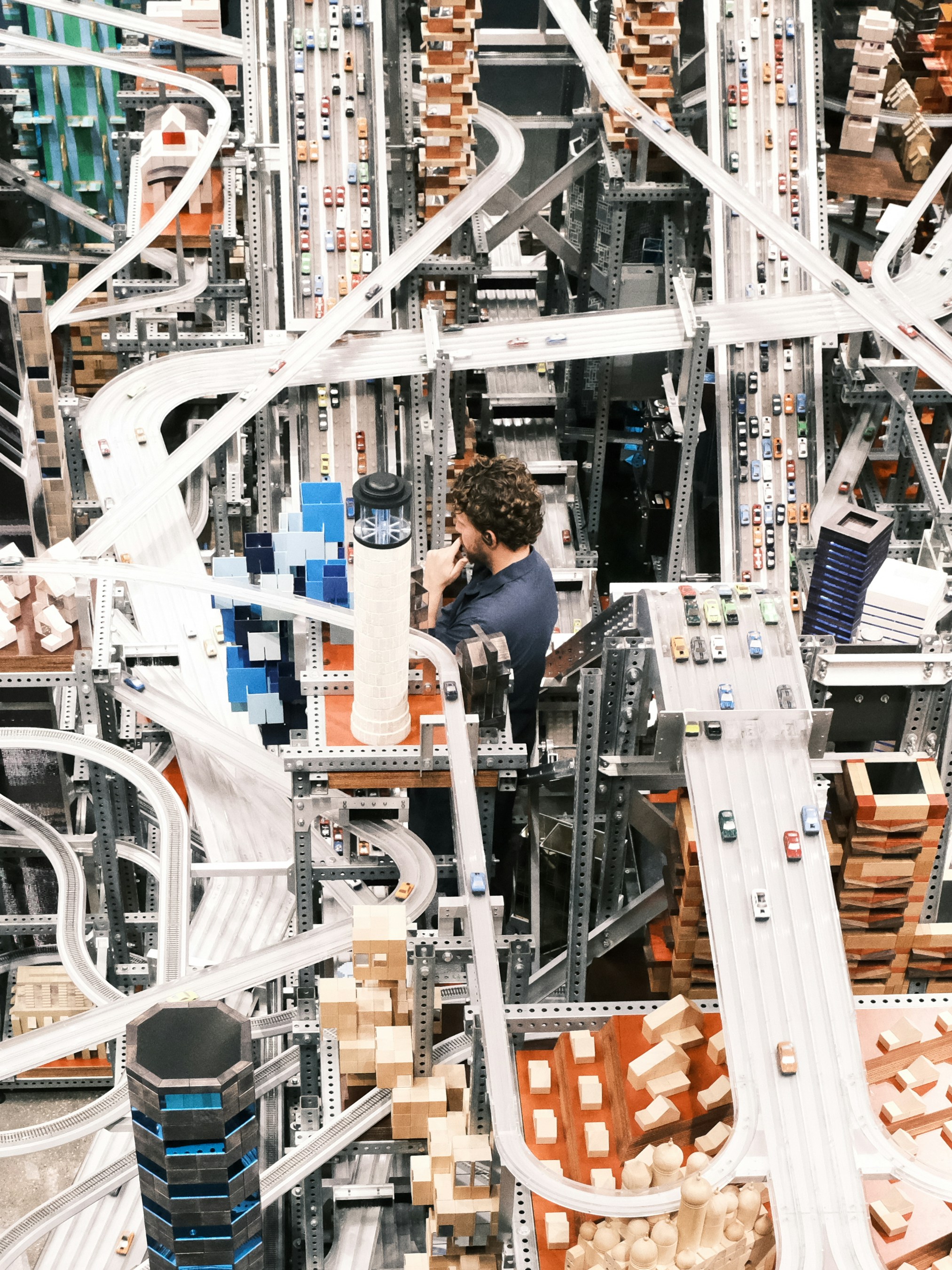 Lone Operator Amid a Megascale Track Maze of Steel and Blocks