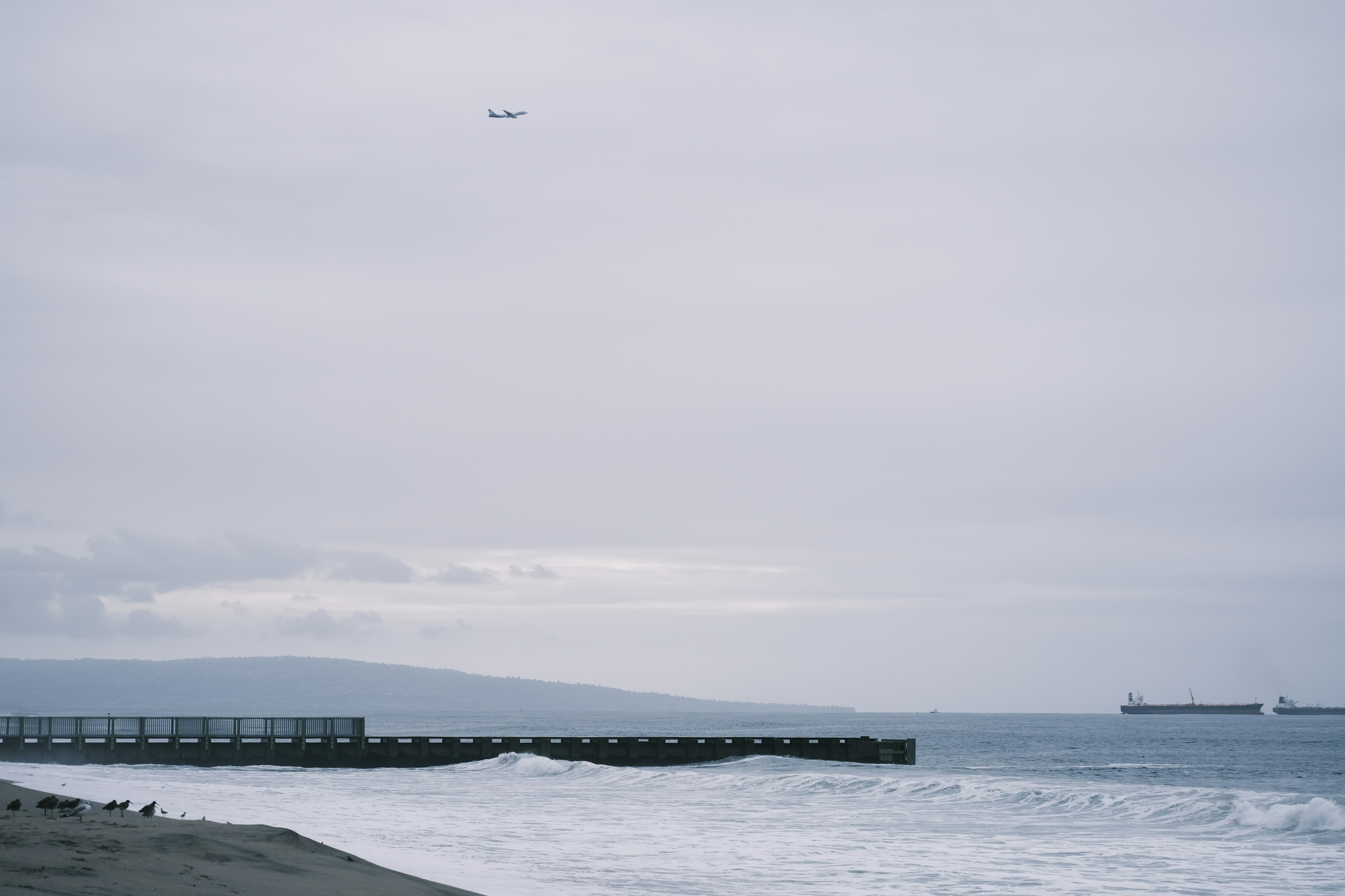 a plane flying over a body of water
