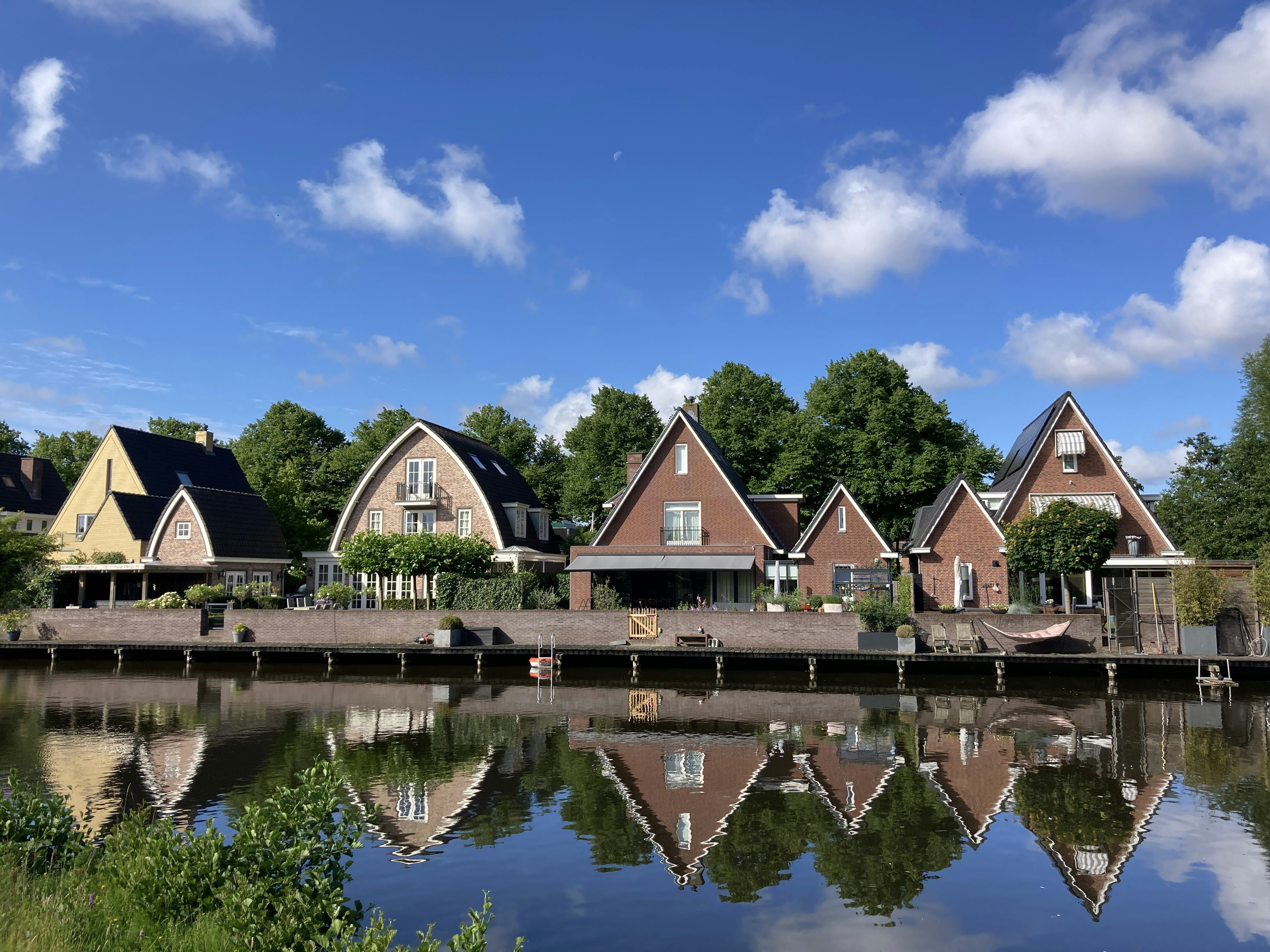 a row of houses next to a body of water
