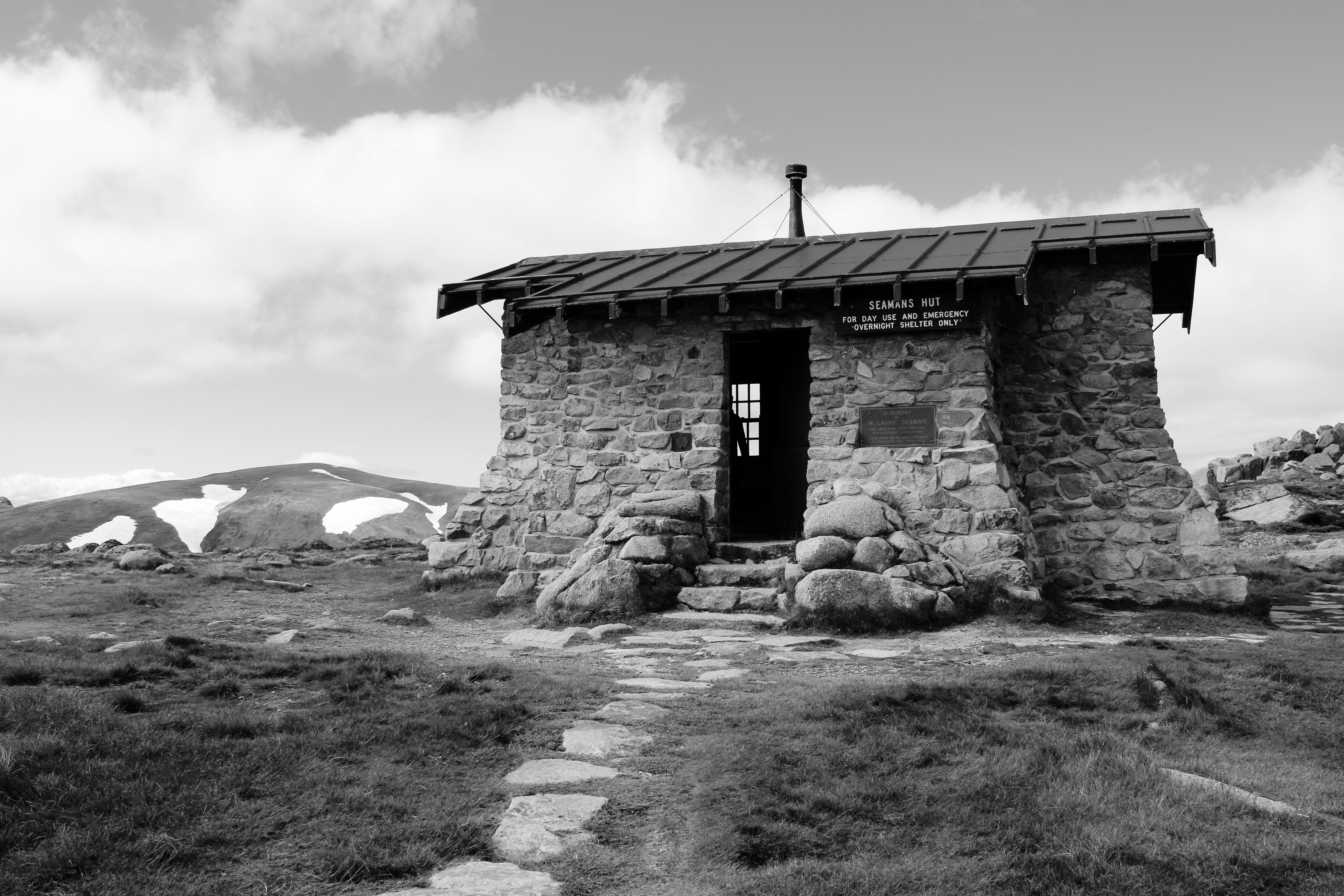 The Silent Sentinel: A Stone Cabin in the Wilderness