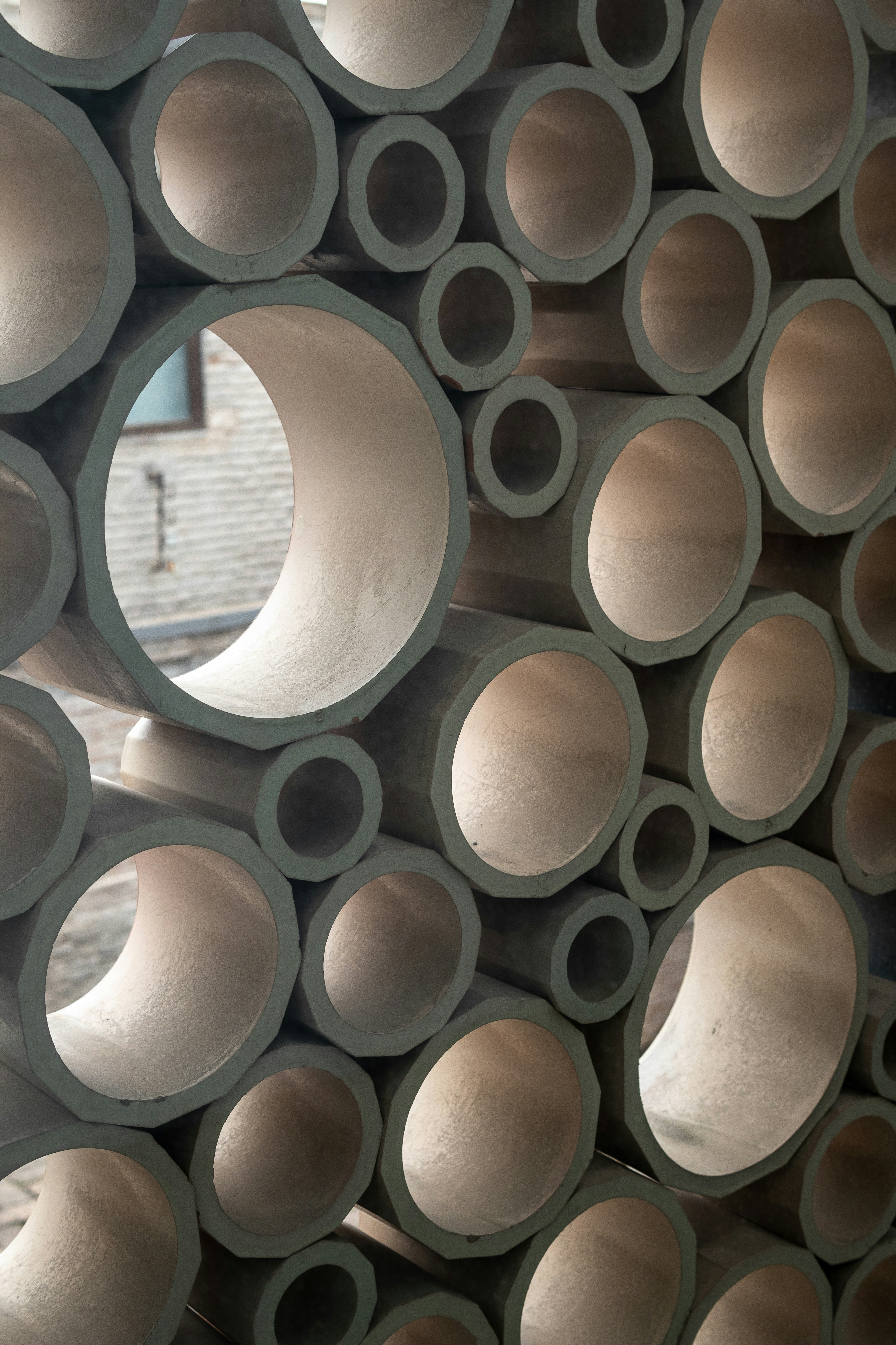 A bunch of pipes stacked on top of each other photo – Free Sevilla ...