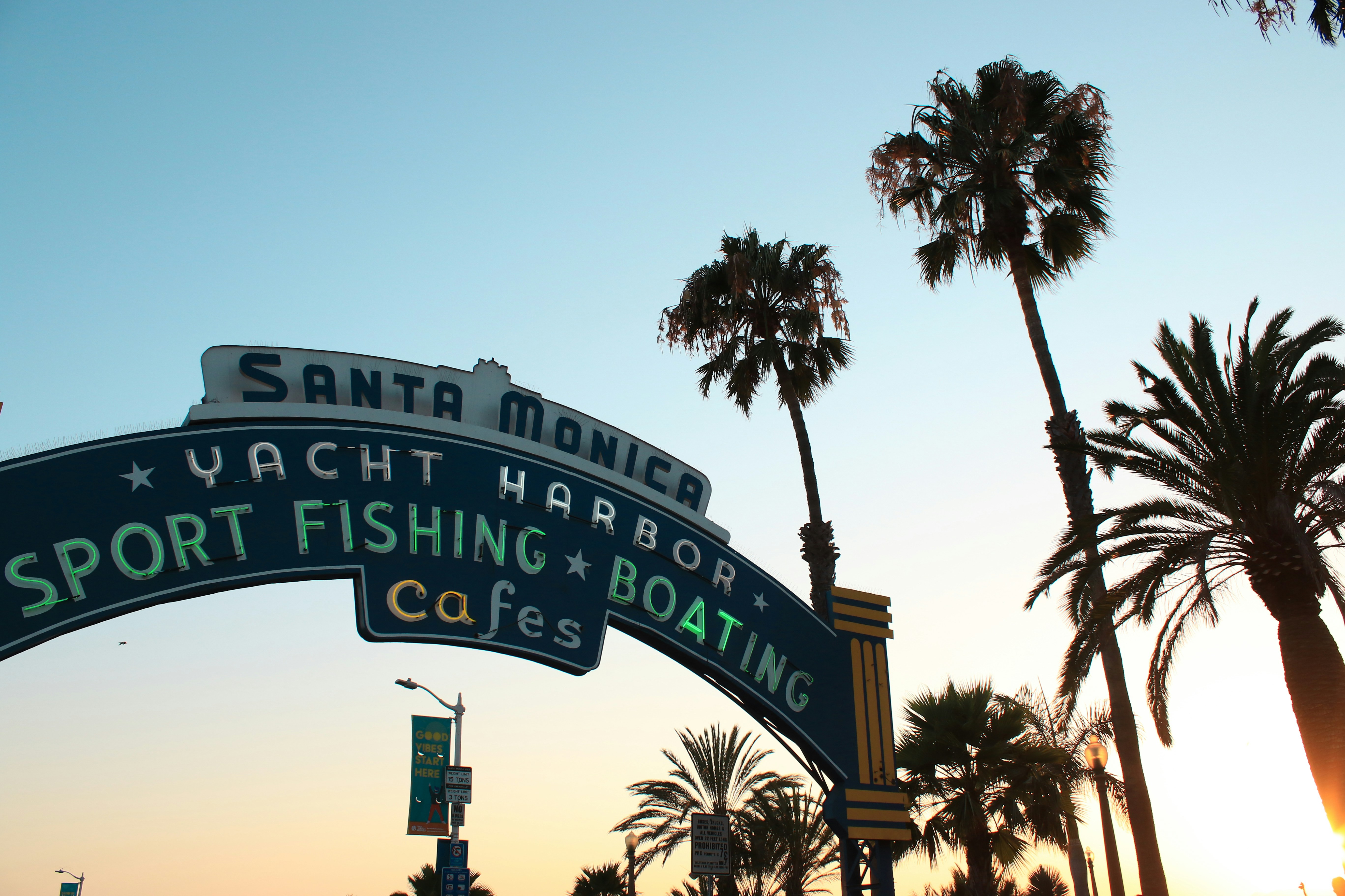 a sign that says sport fishing boating and santa monica beach