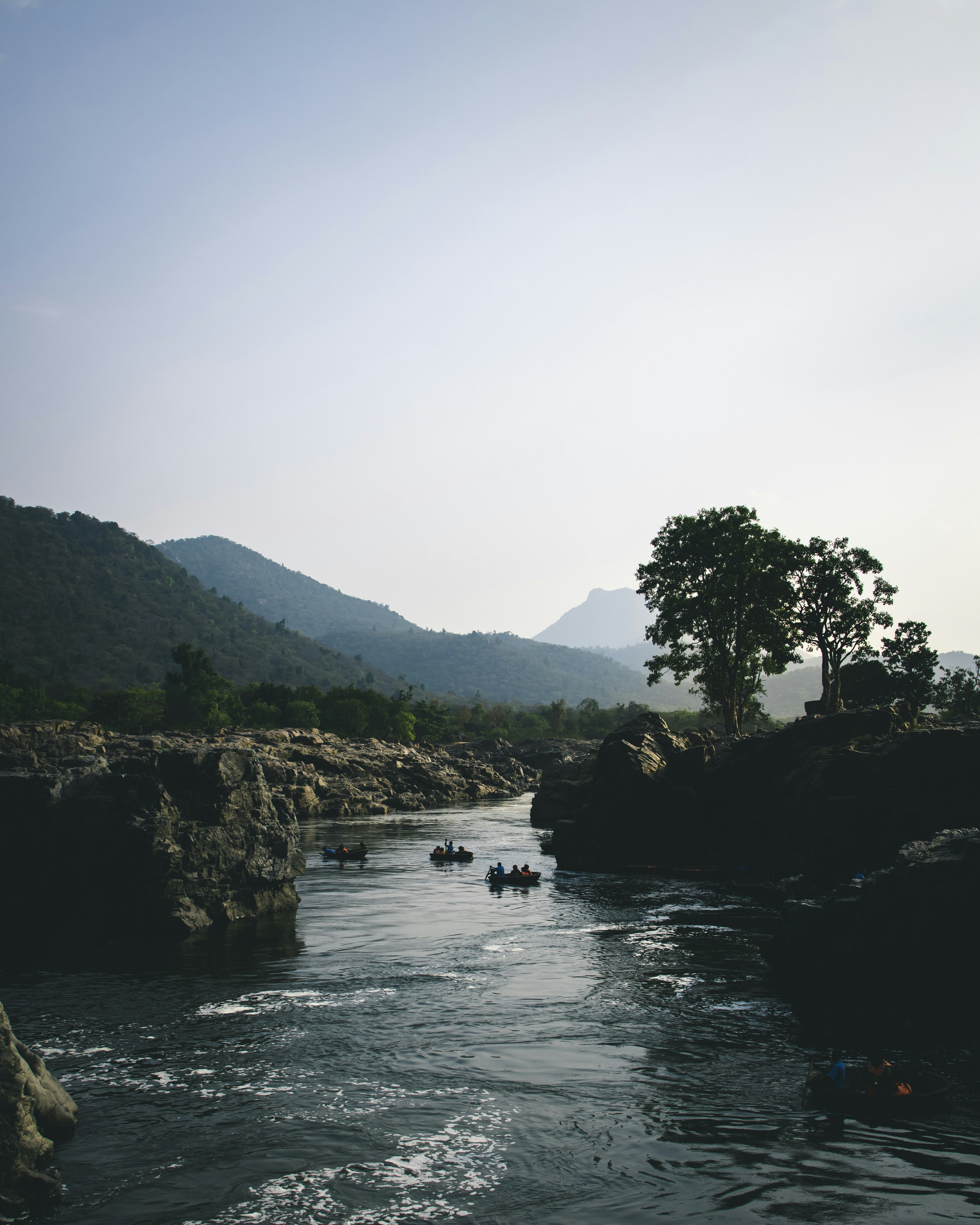 A group of people in small boats on a river photo – Free Waterfall ...