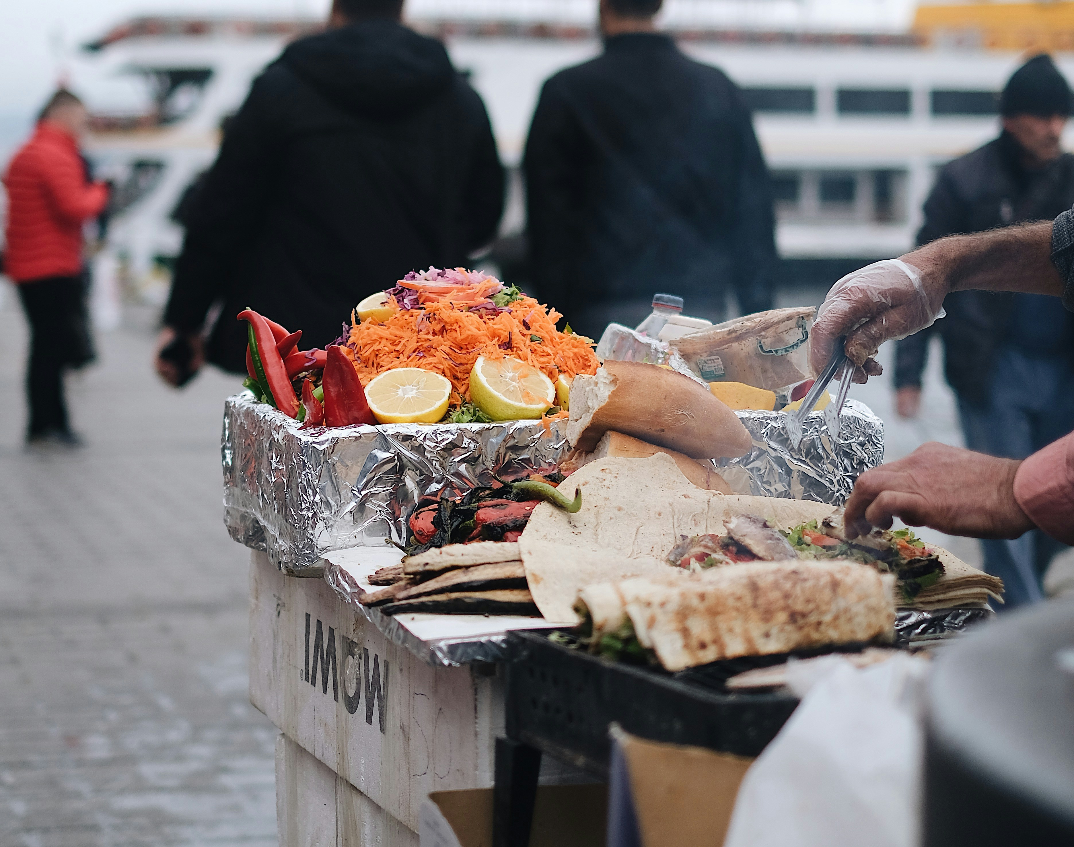 Foil-Wrapped Street Grill: Citrus, Pita, and Color on a Busy Corner