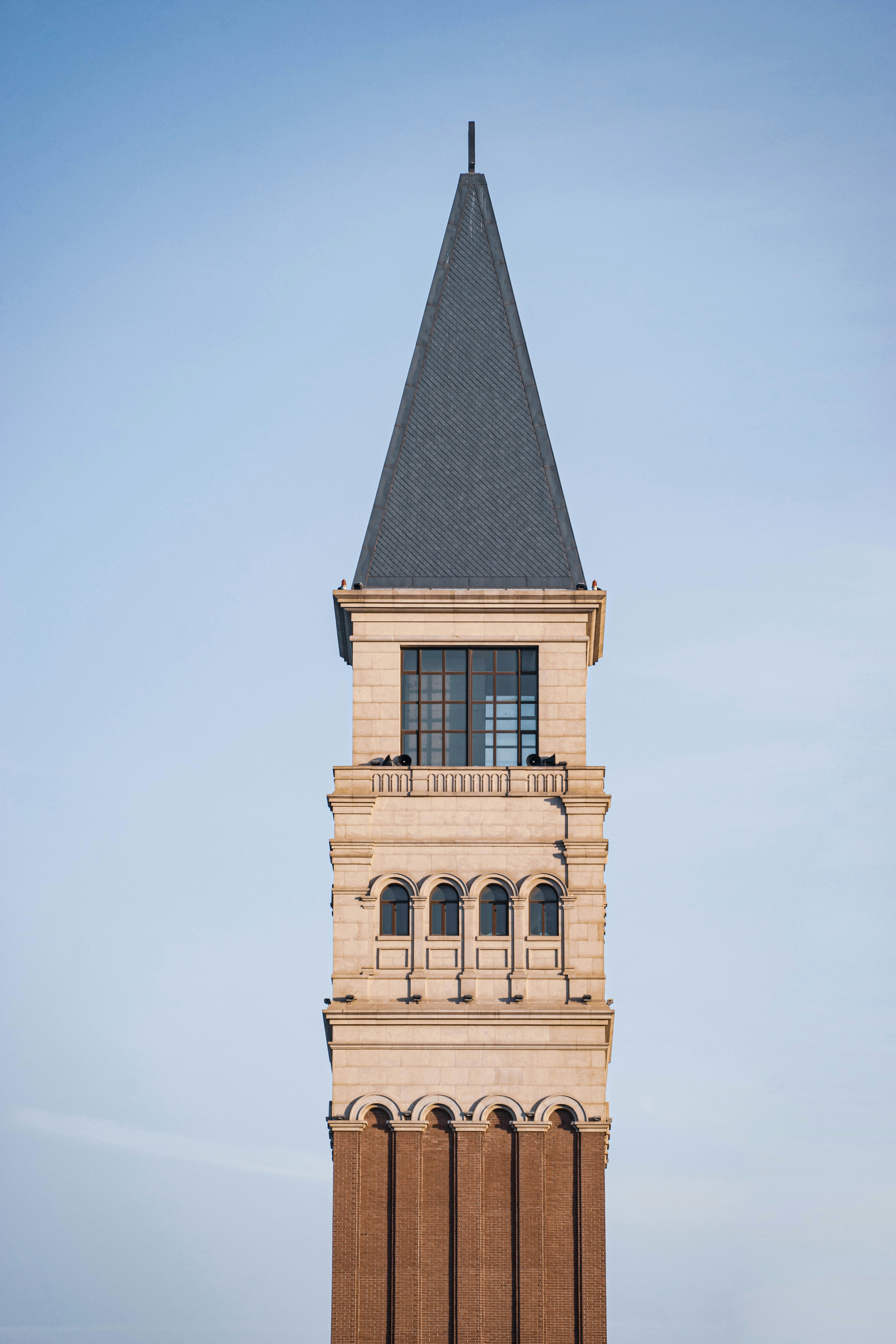 A tall clock tower with a sky background photo – Free Image on Unsplash