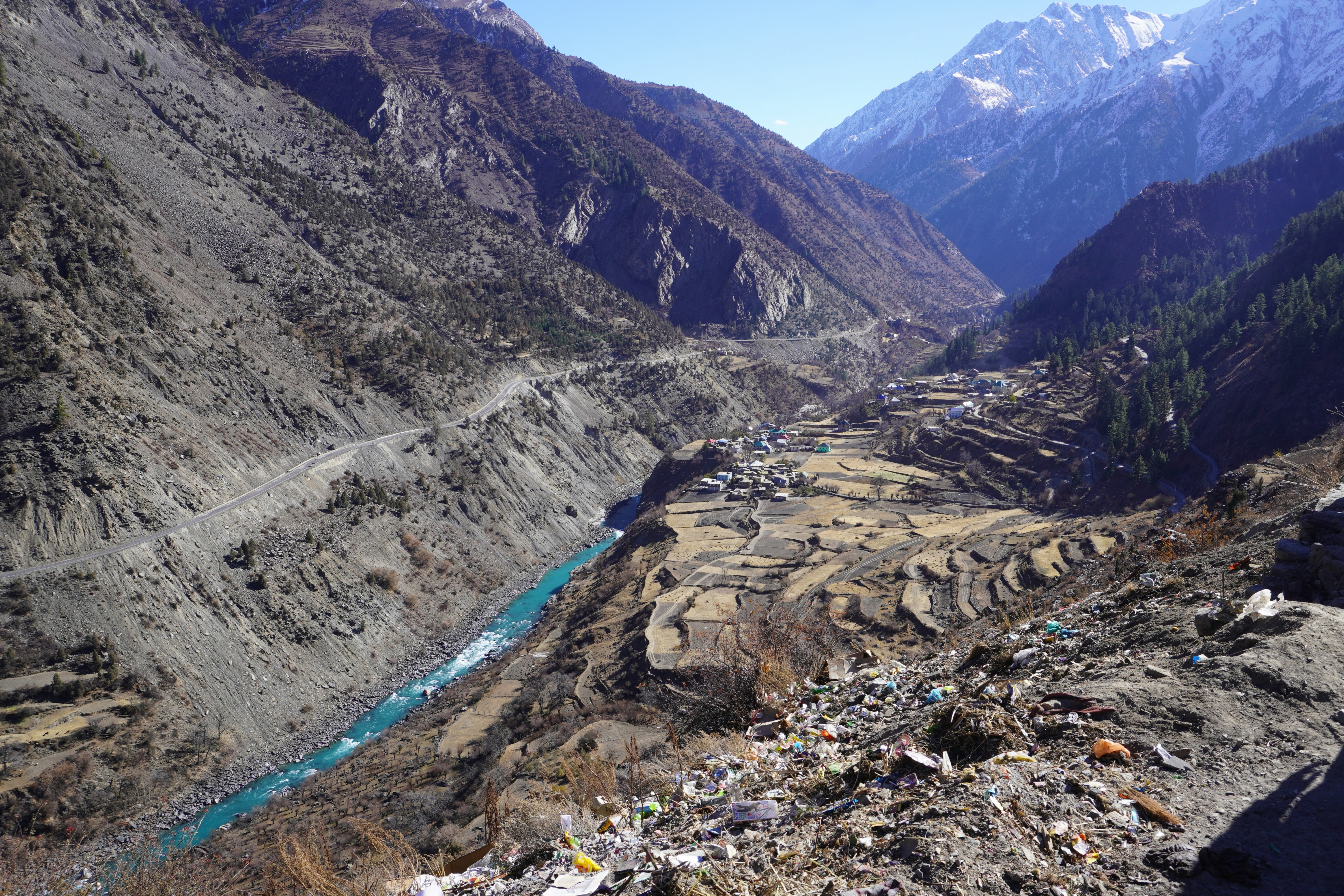 A river running through a valley surrounded by mountains photo – Free ...