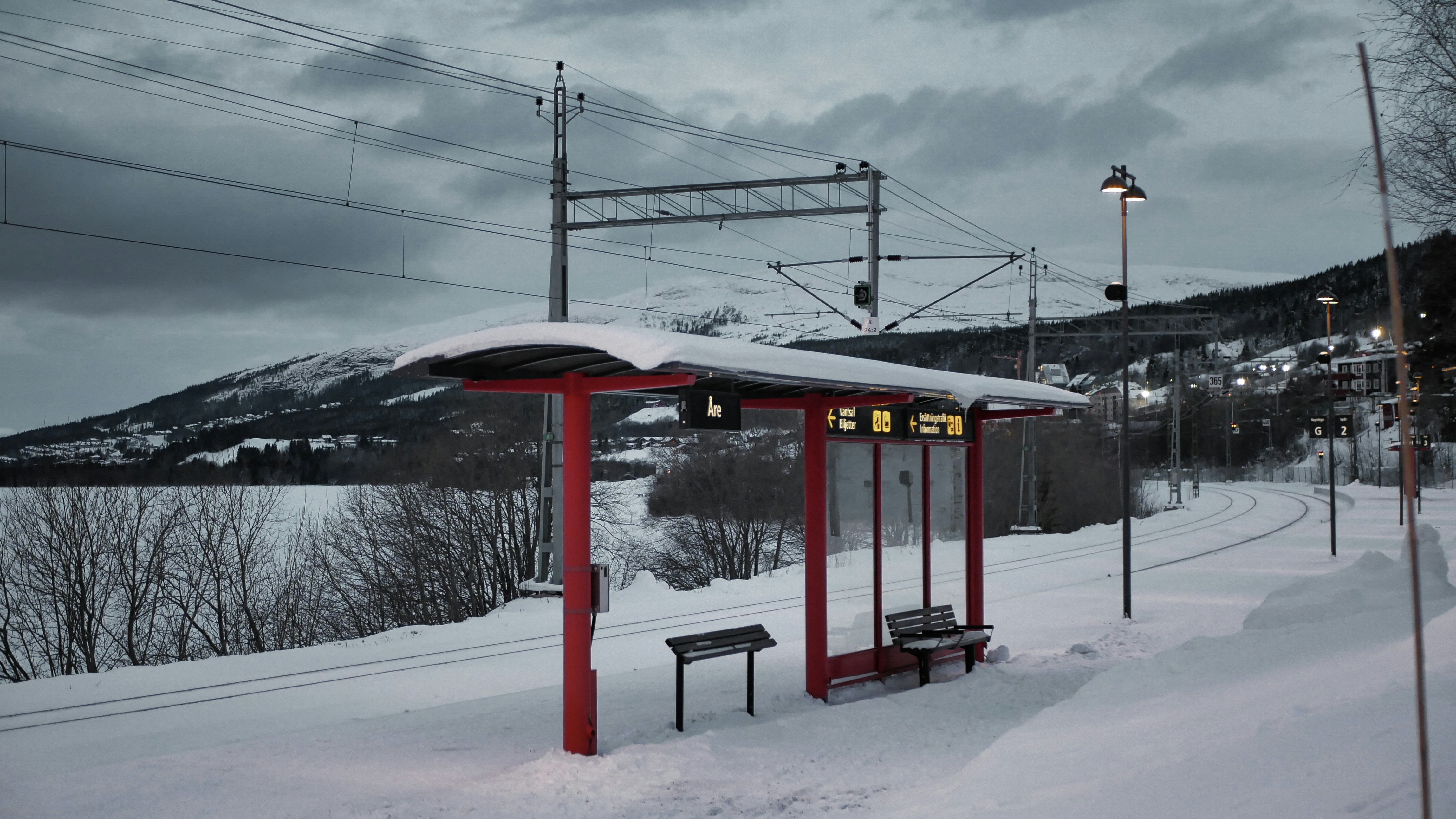 Red Snowbound Stop: A Quiet Platform in the White Landscape