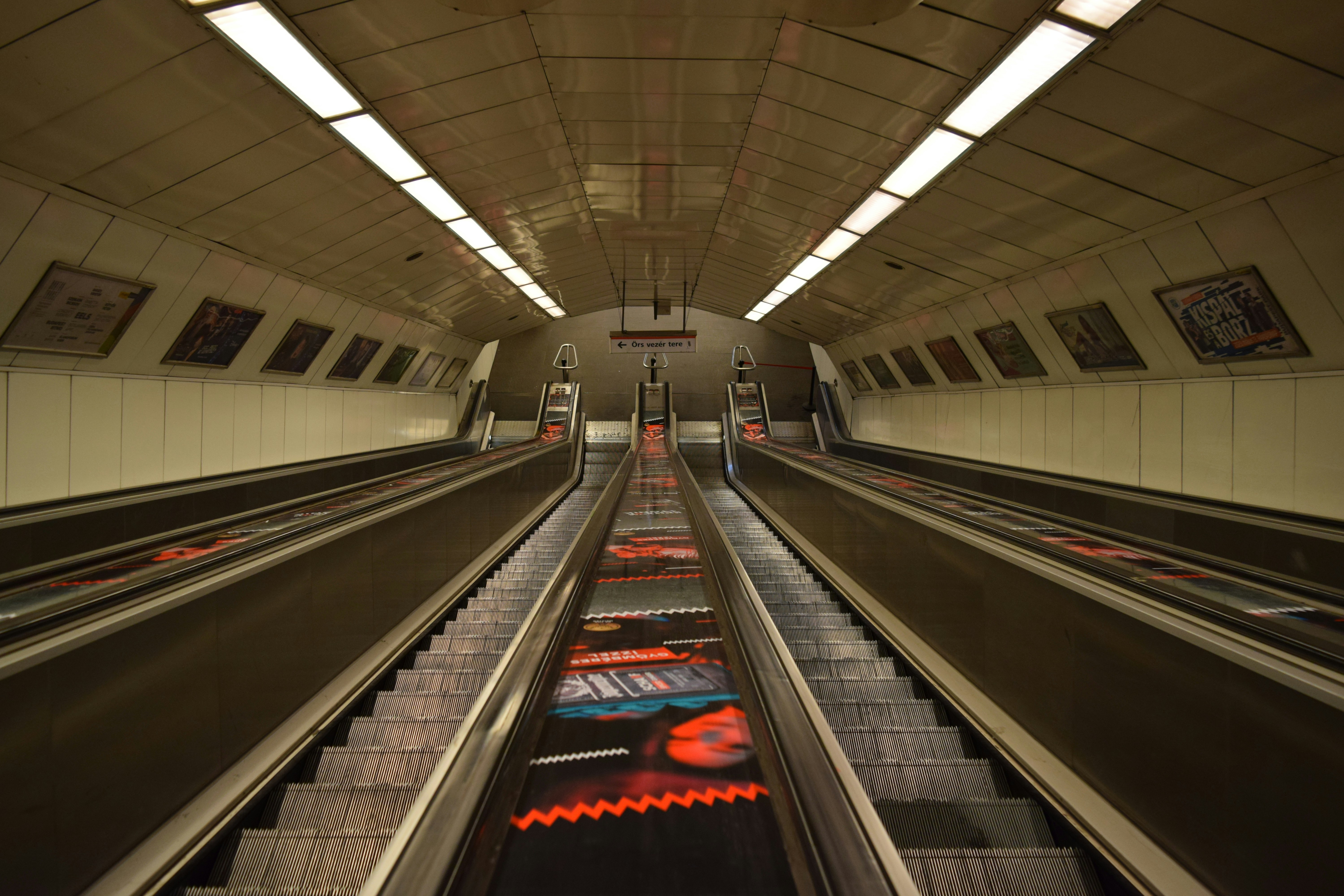 Vanishing Rails: Symmetry and Light in an Empty Underground Escalator Hall