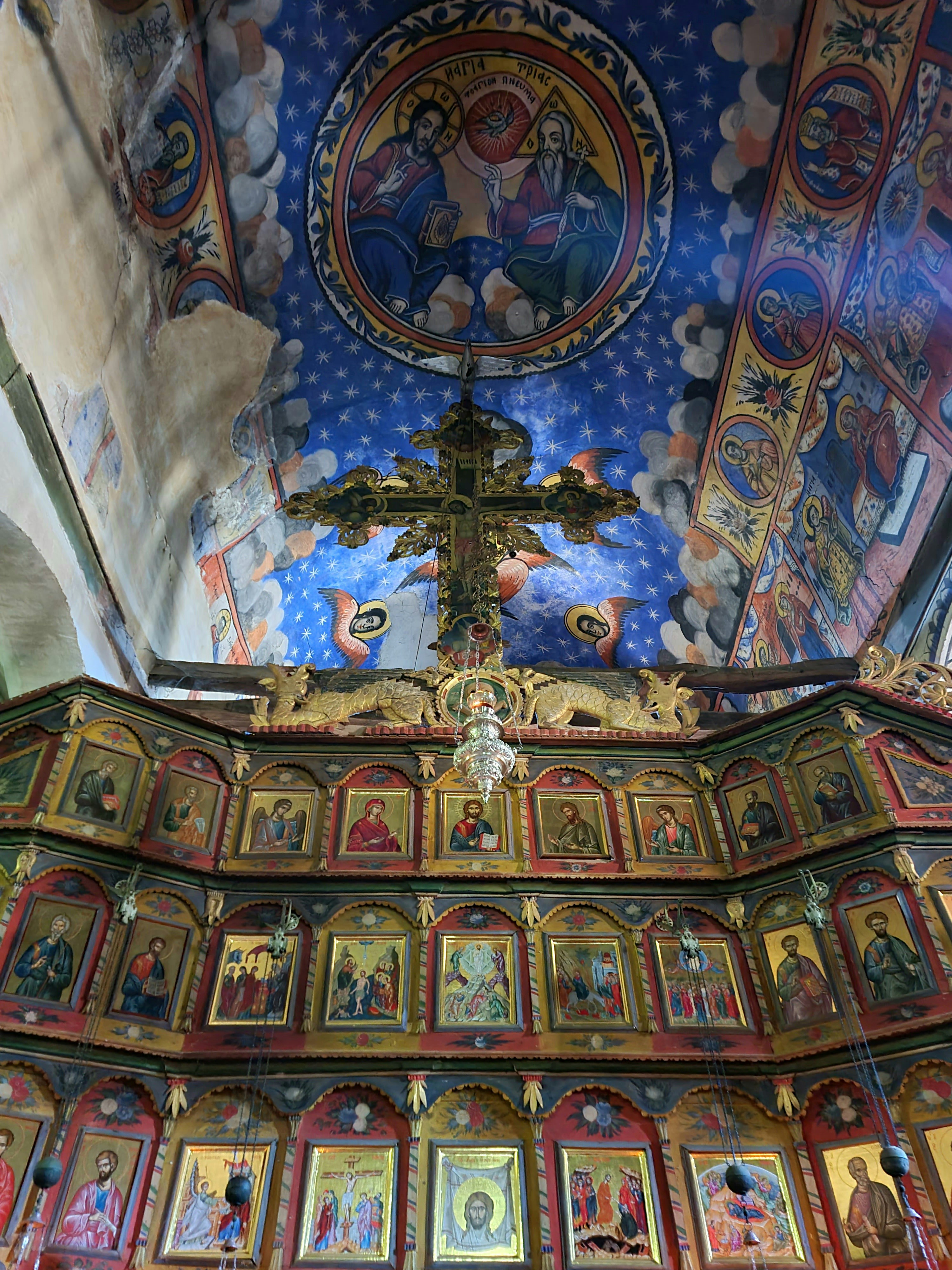 Archan | a church with a cross painted on the ceiling