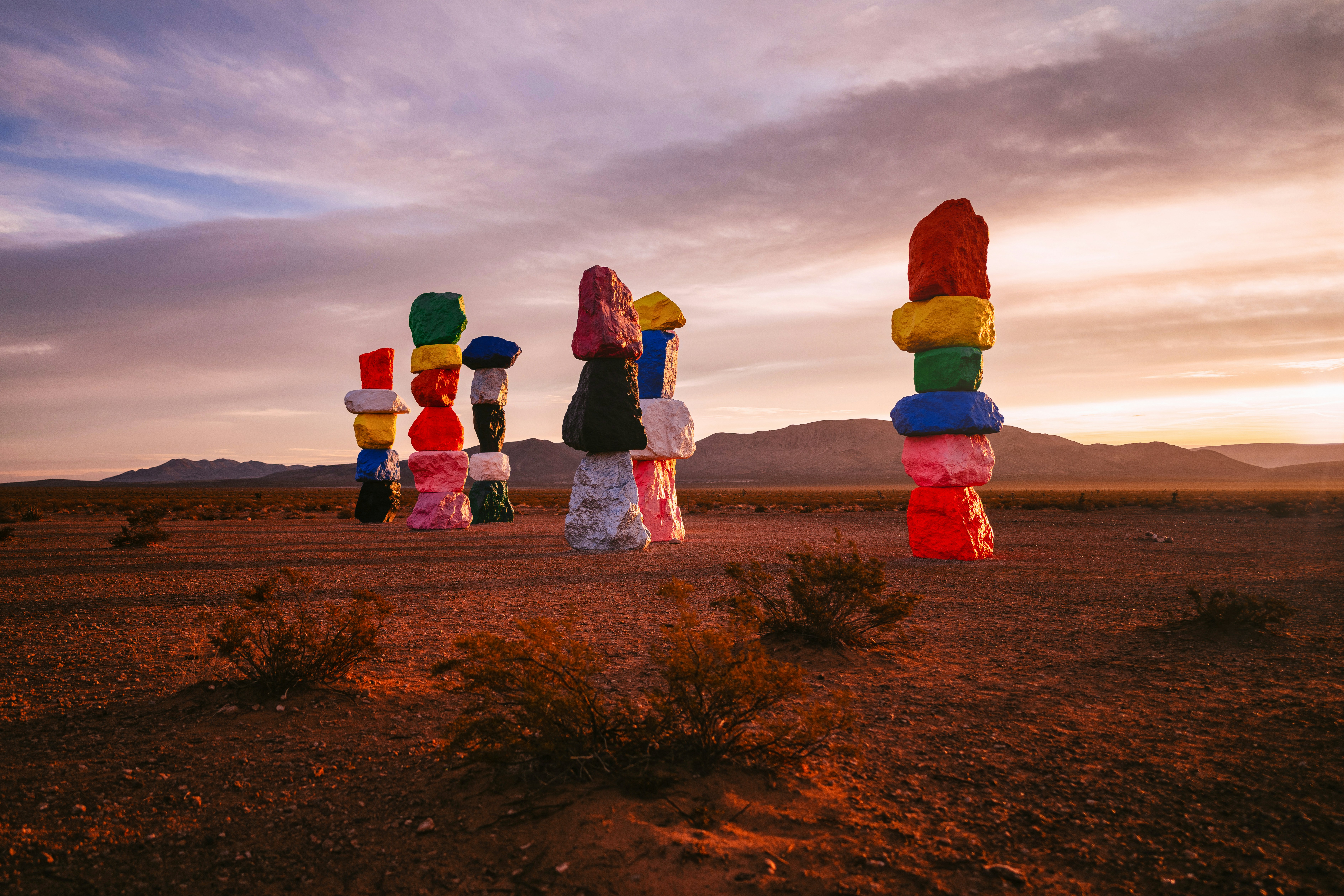 Sunset Over Neon Stacks: Colorful Pillars Rise in the Mojave Desert